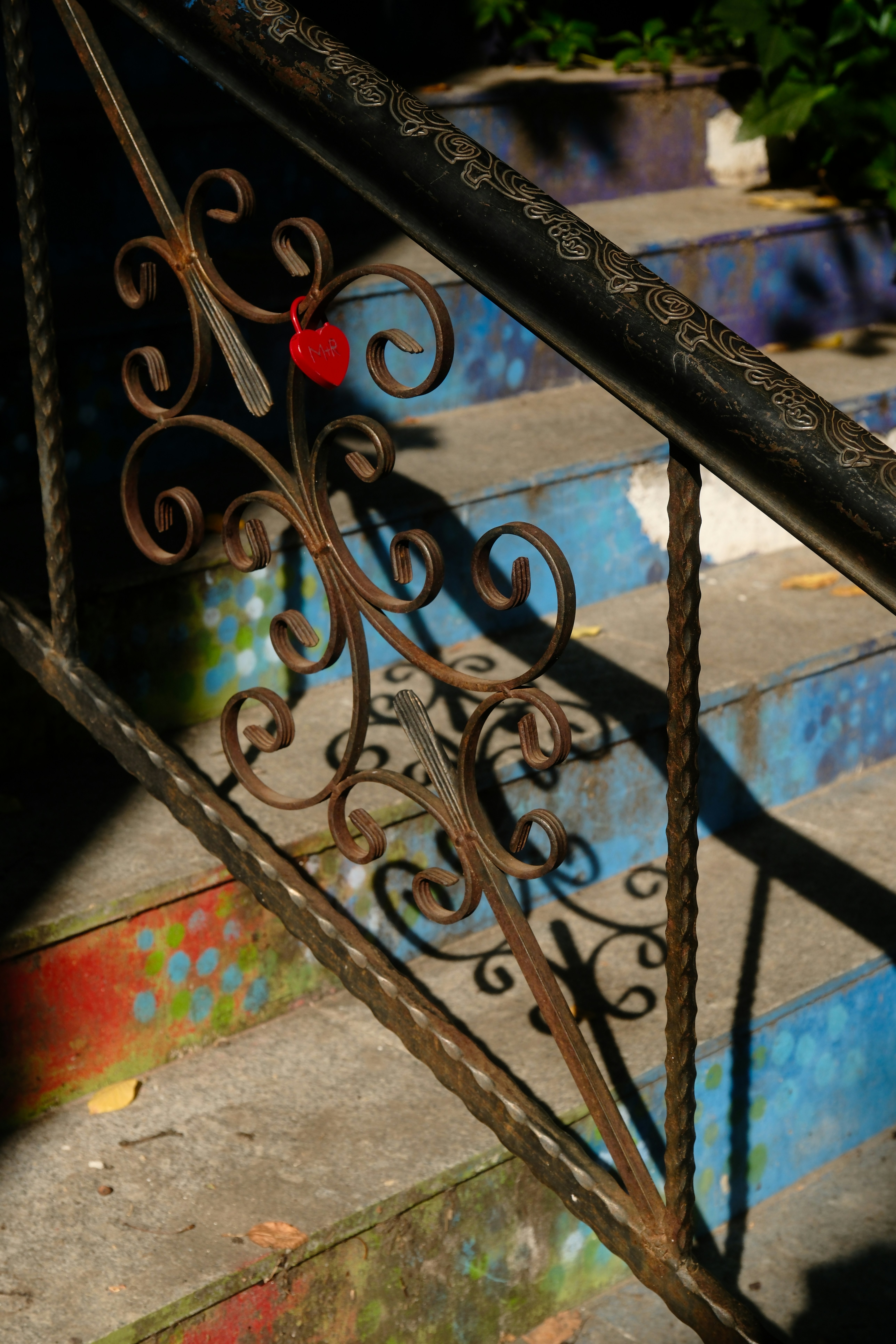 Heart on the Railing: A Lock and Shadow Play on the Stairs