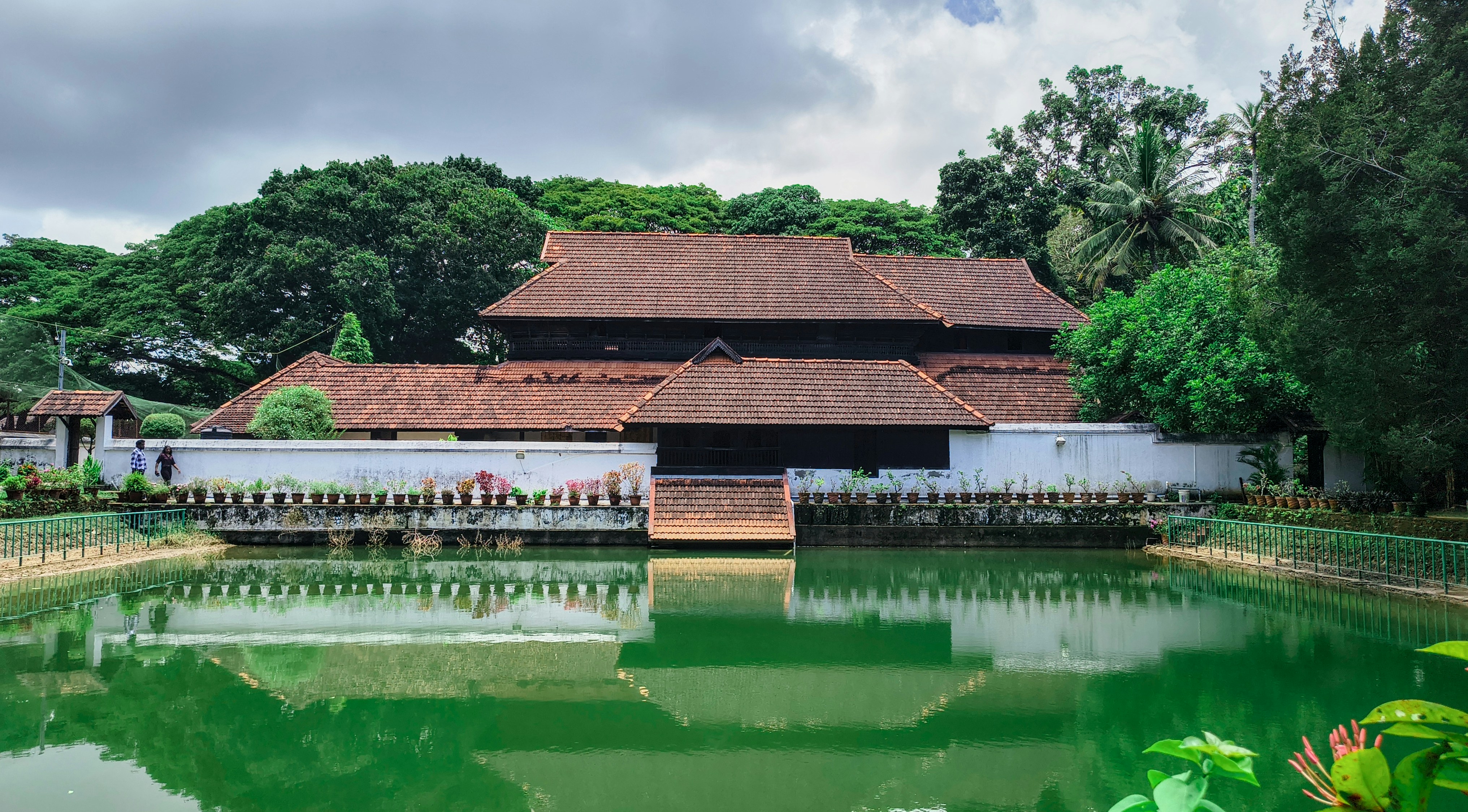 Temple by the Pond: Tranquil Waters and Traditional Roofline