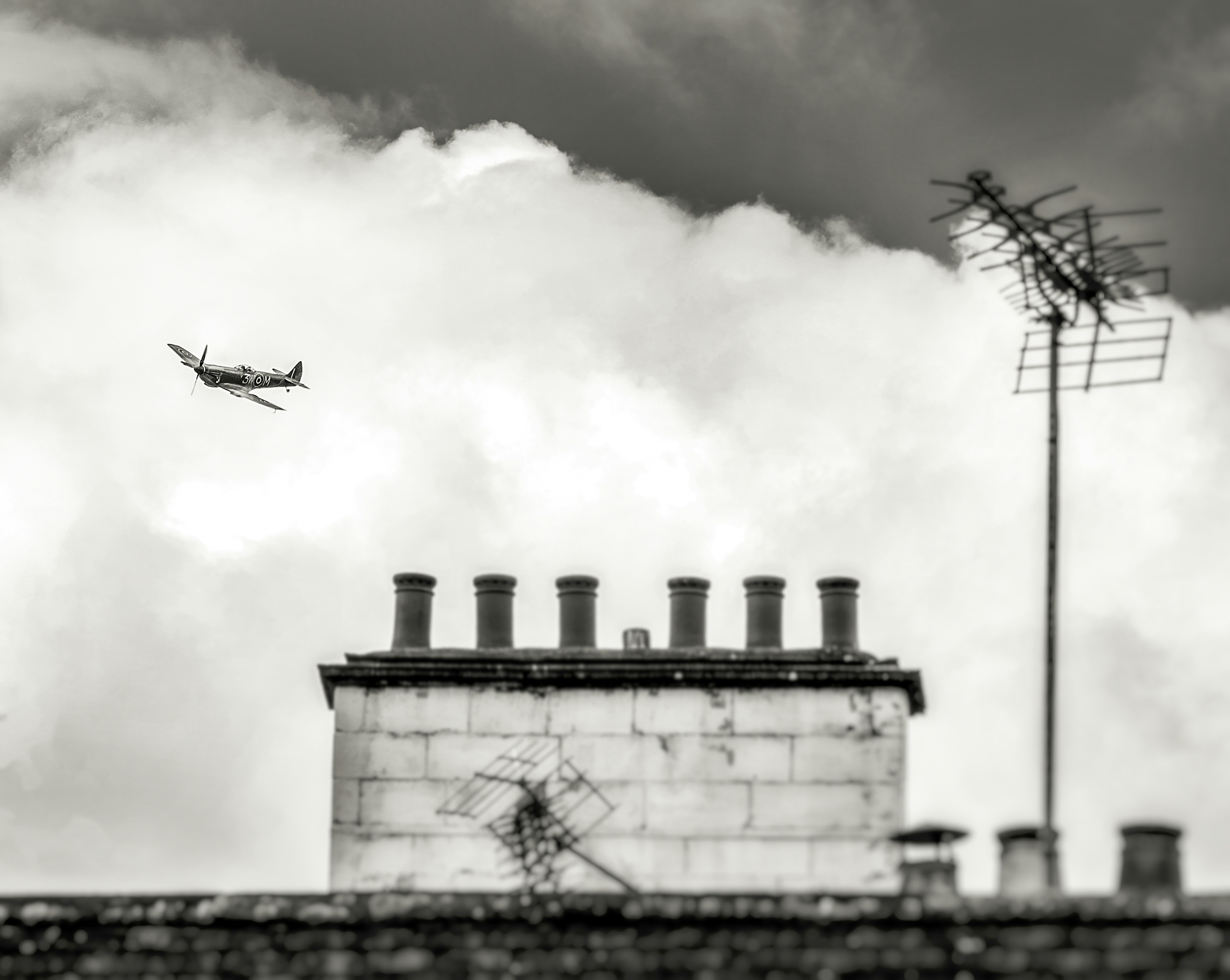 Roaring Sky Over a Rooftop: A Tied-Top Plane Against Stormy Clouds
