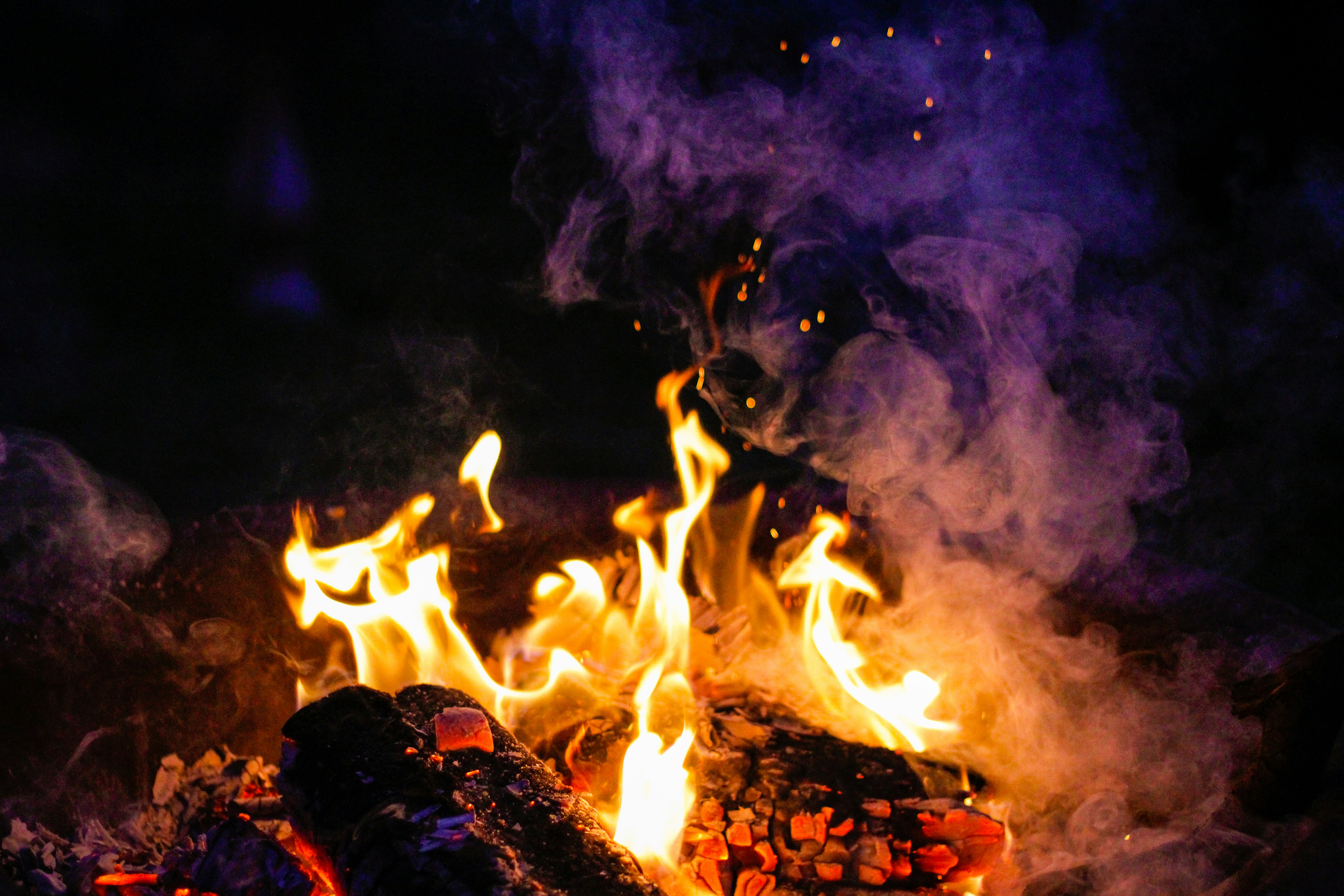 Lanterns of Ember: Nightfire on Charred Logs