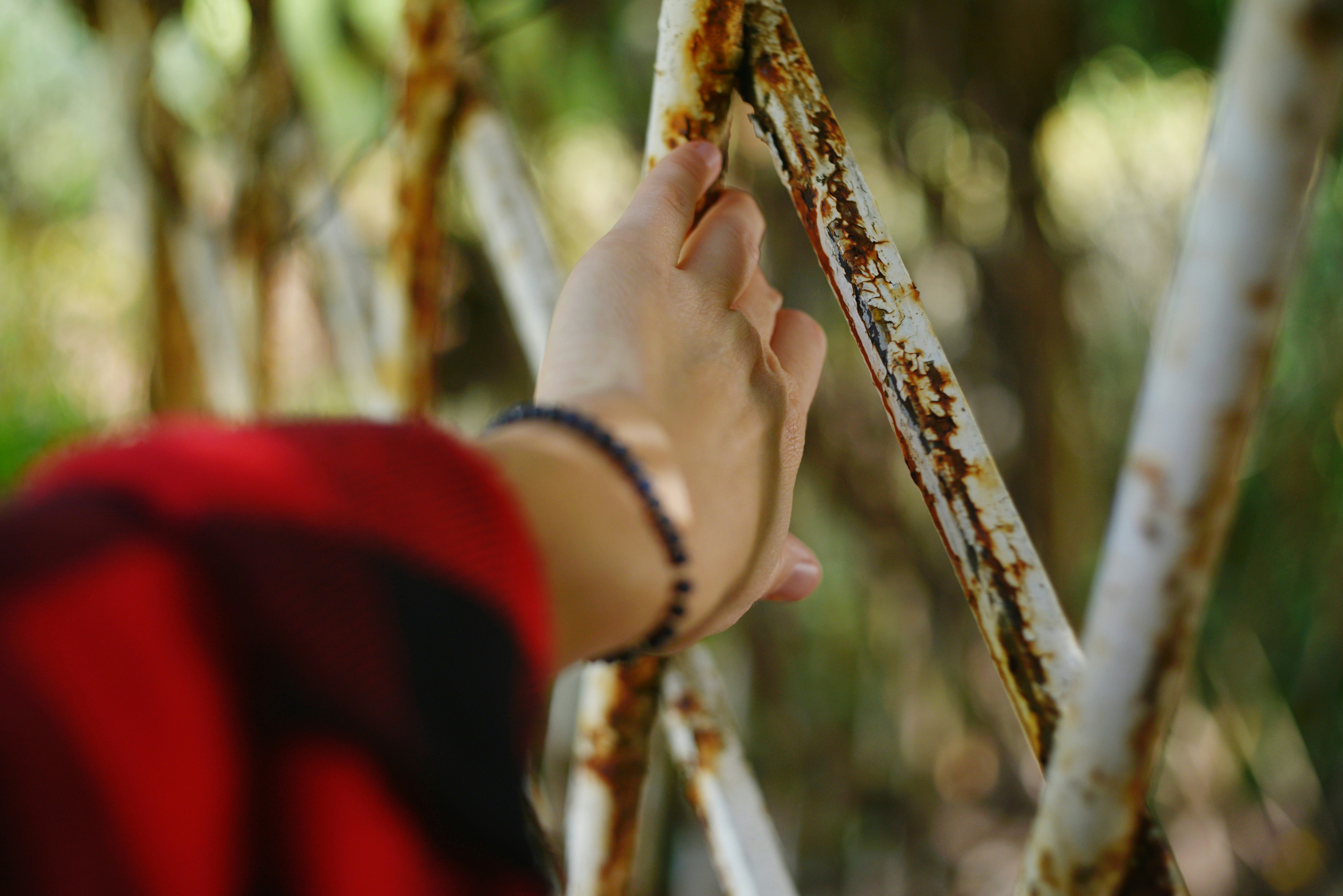 Hands Clasped to Climb: Rusty Rails Meet Childhood Resolve