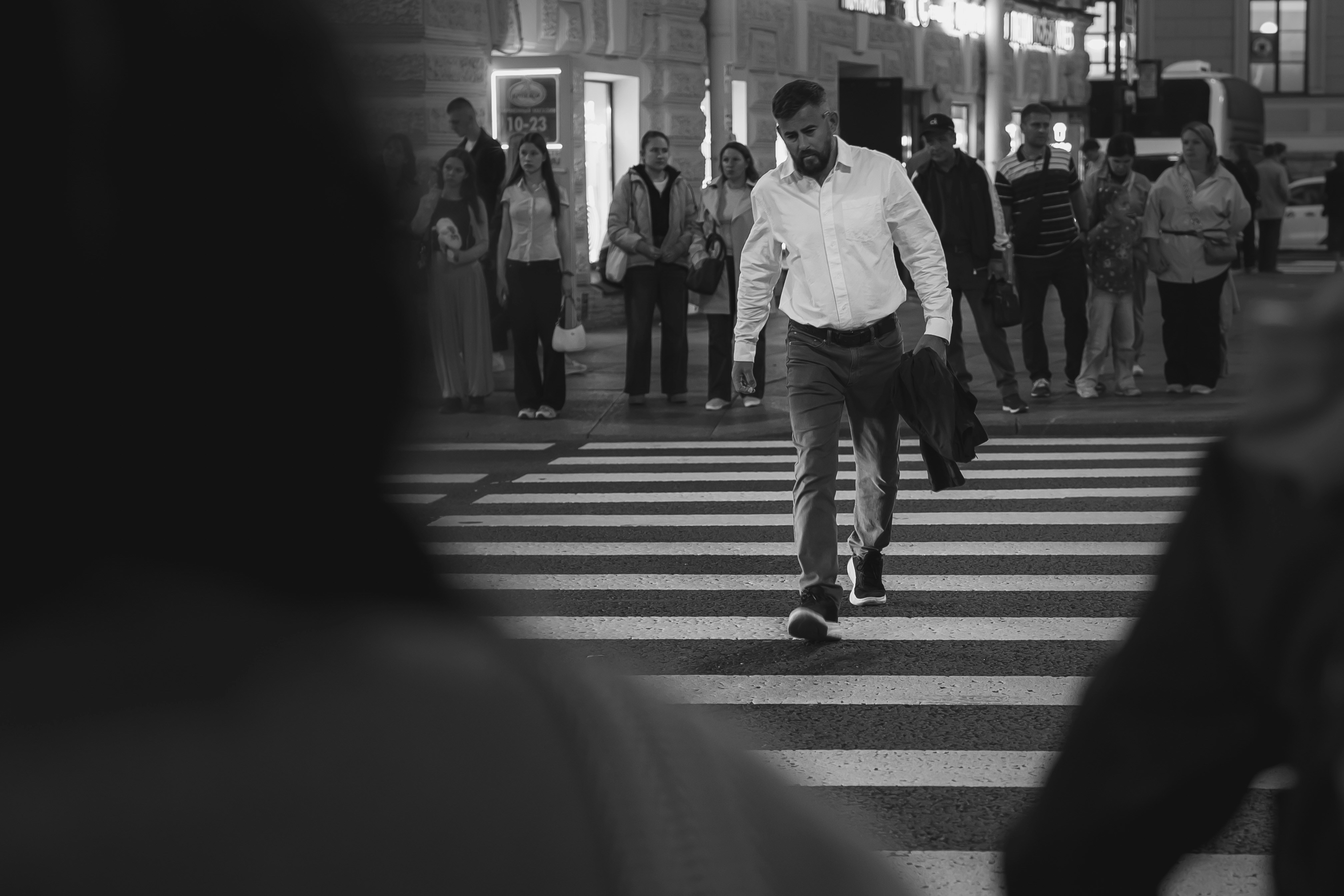 Crossing Silence: A City Man Amid the Zebra Stripes
