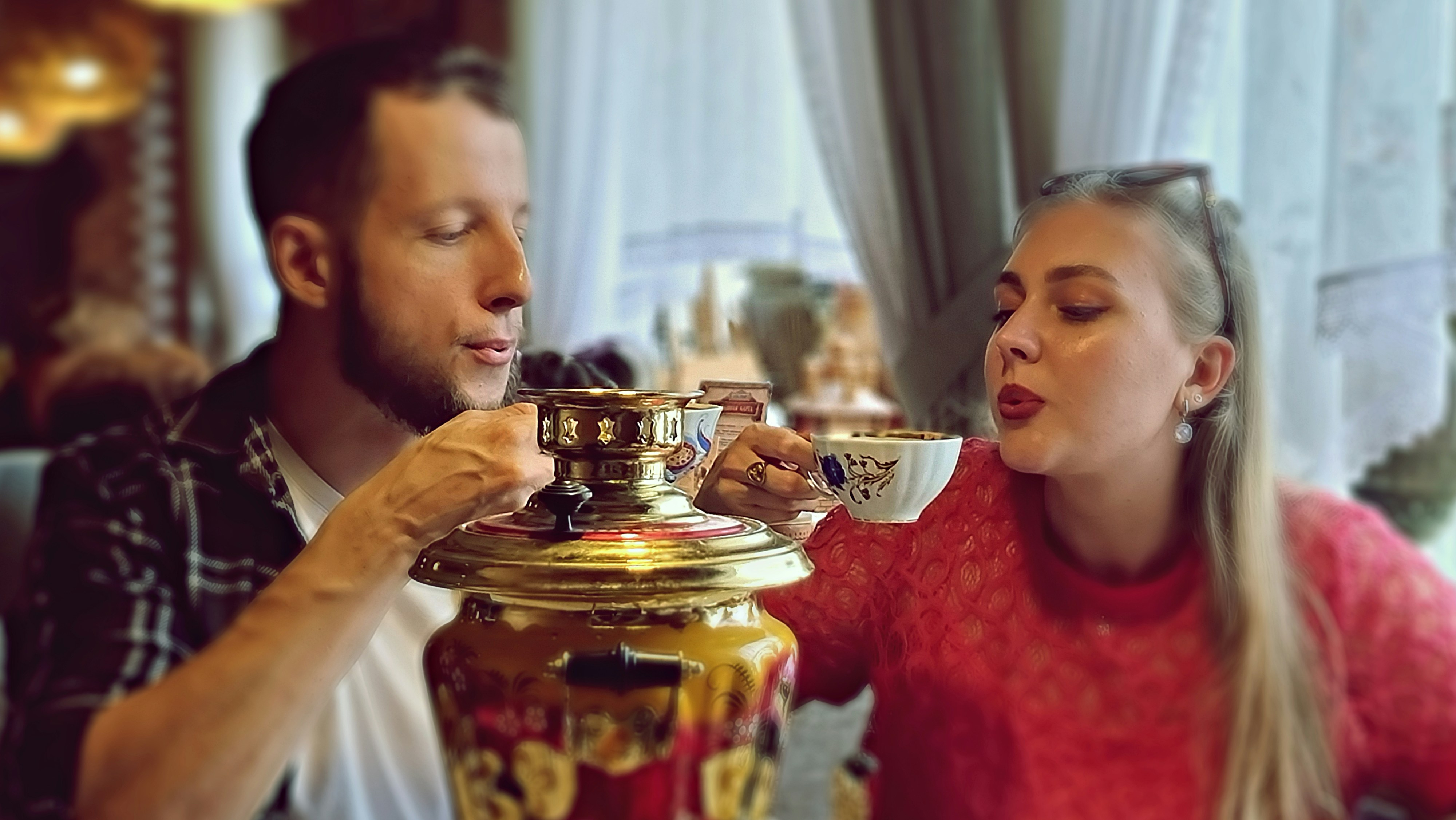 Tea Time for Two: A Warm Moment Over a Golden Samovar