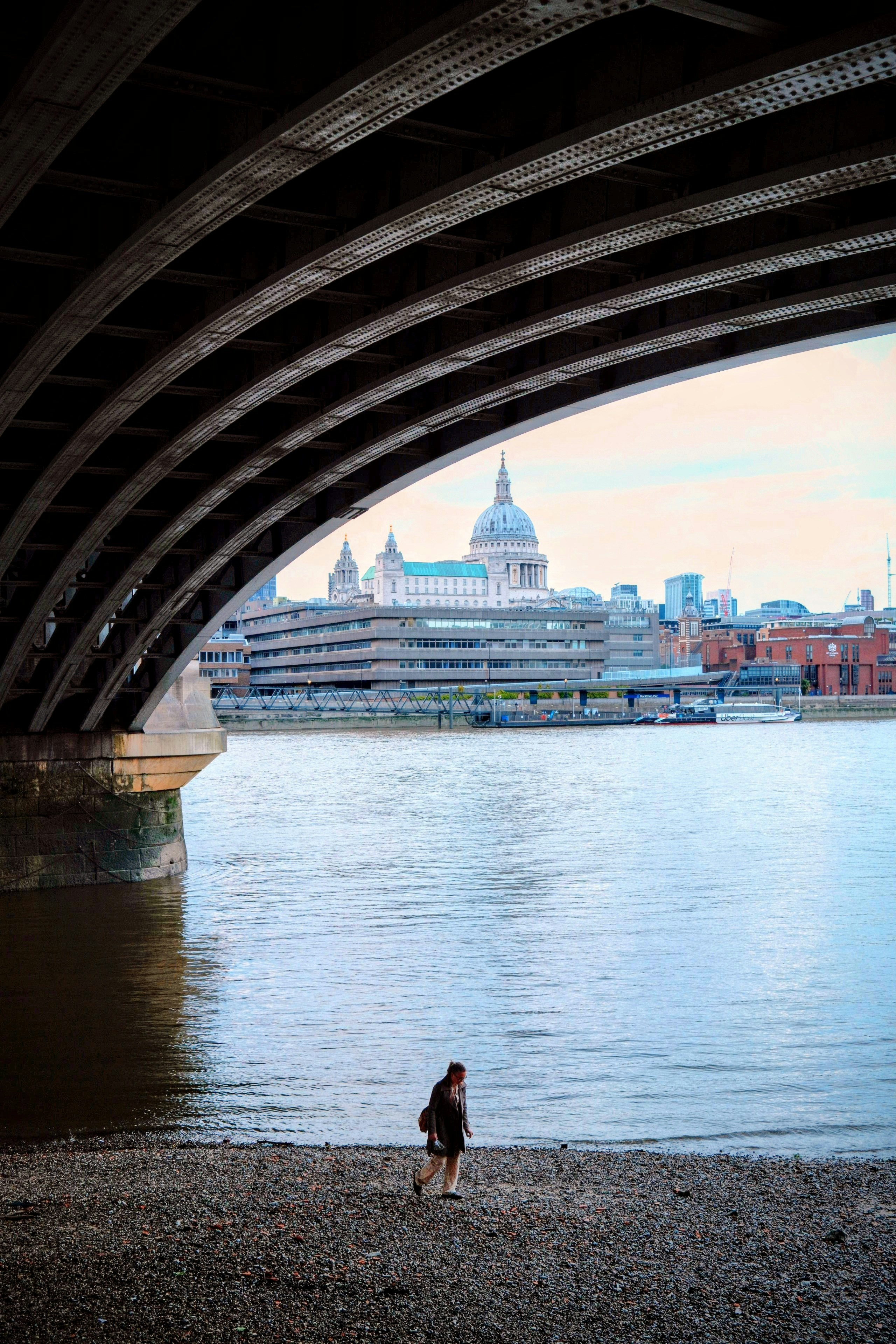 Under the Arch: A Quiet Figure by the Thames