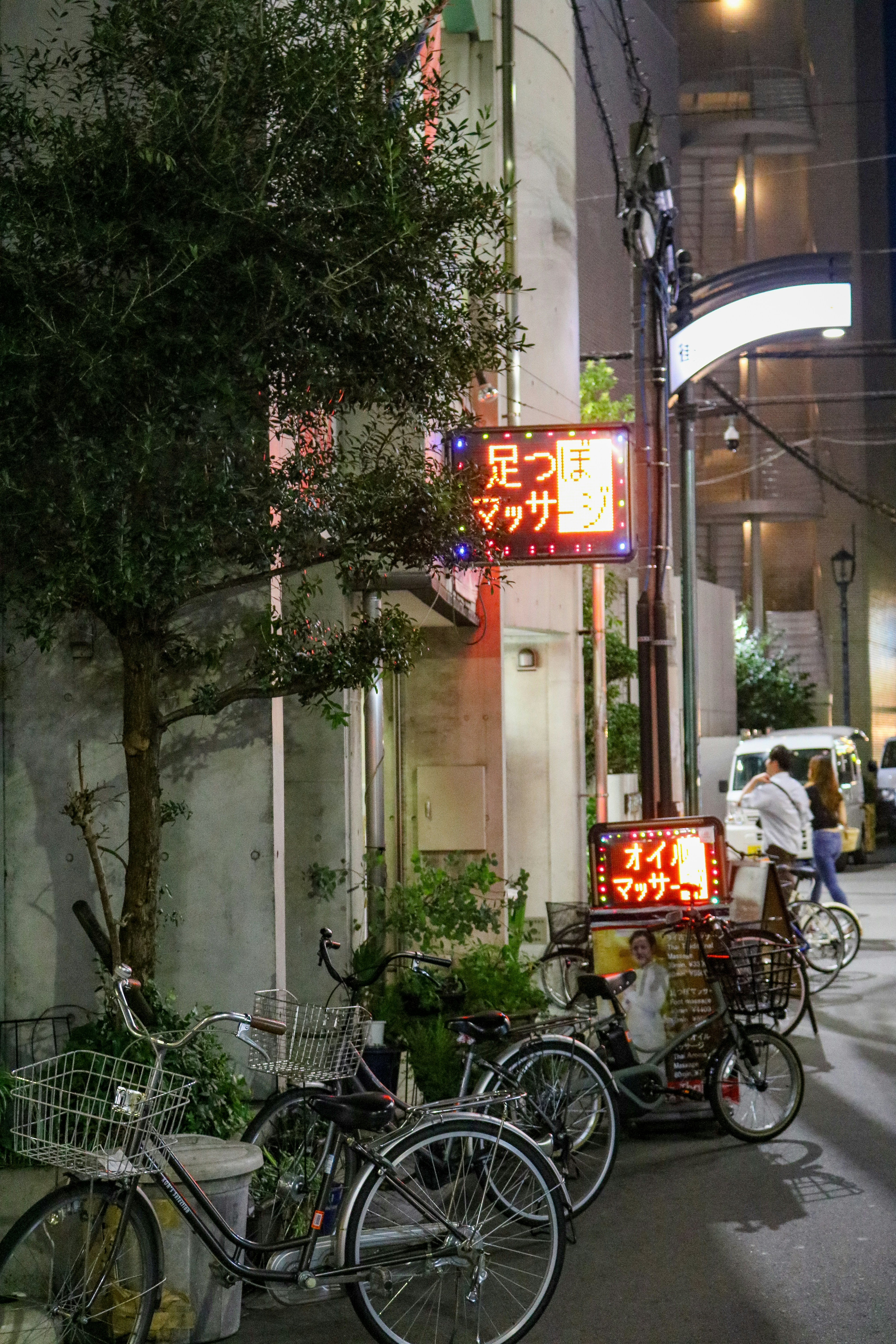 Neon Signage and Bicycle Alley on a Quiet Tokyo Night