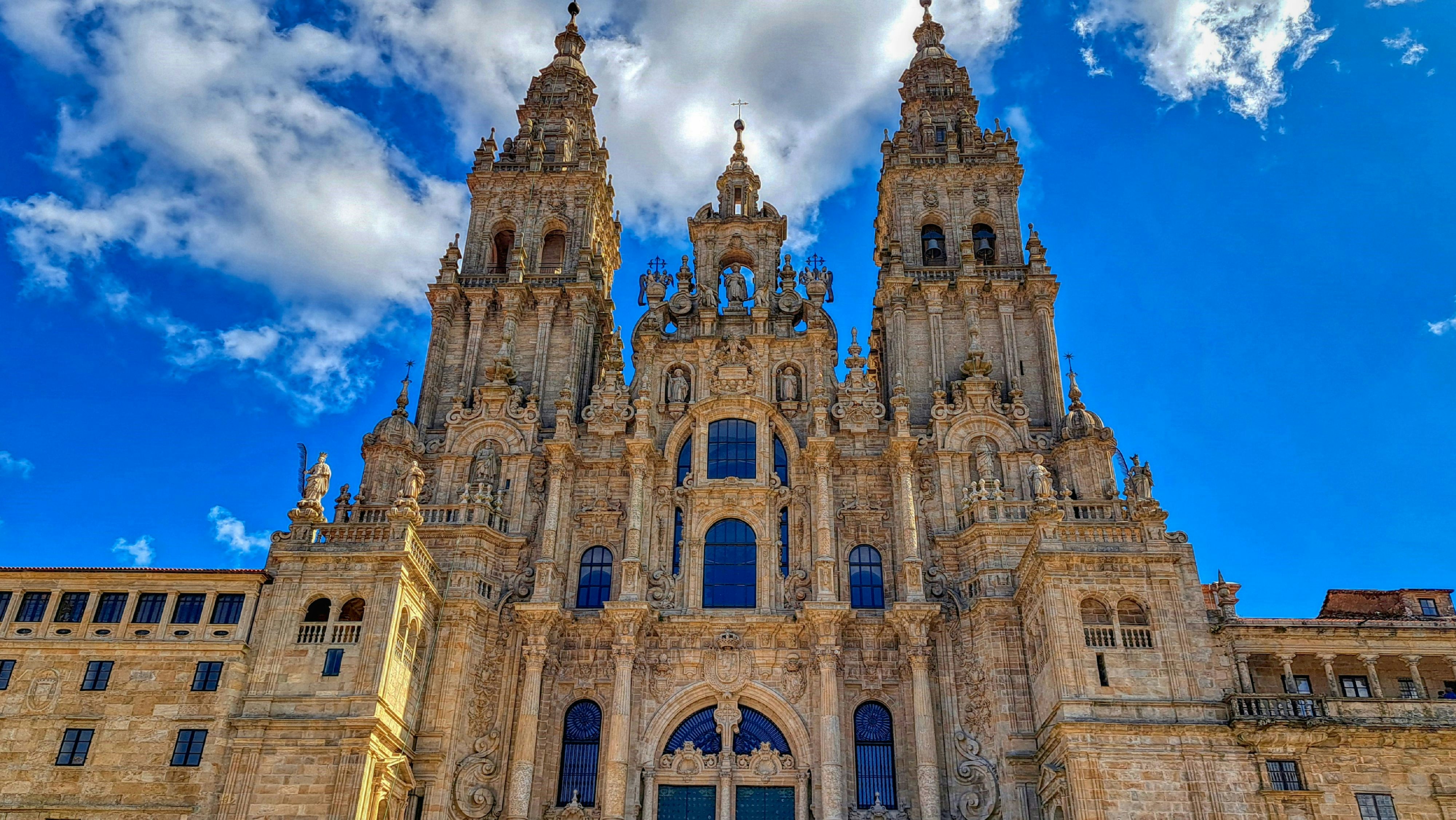 Gilded Facade Ascending: Baroque Cathedral Soaring Against a Cerulean Sky