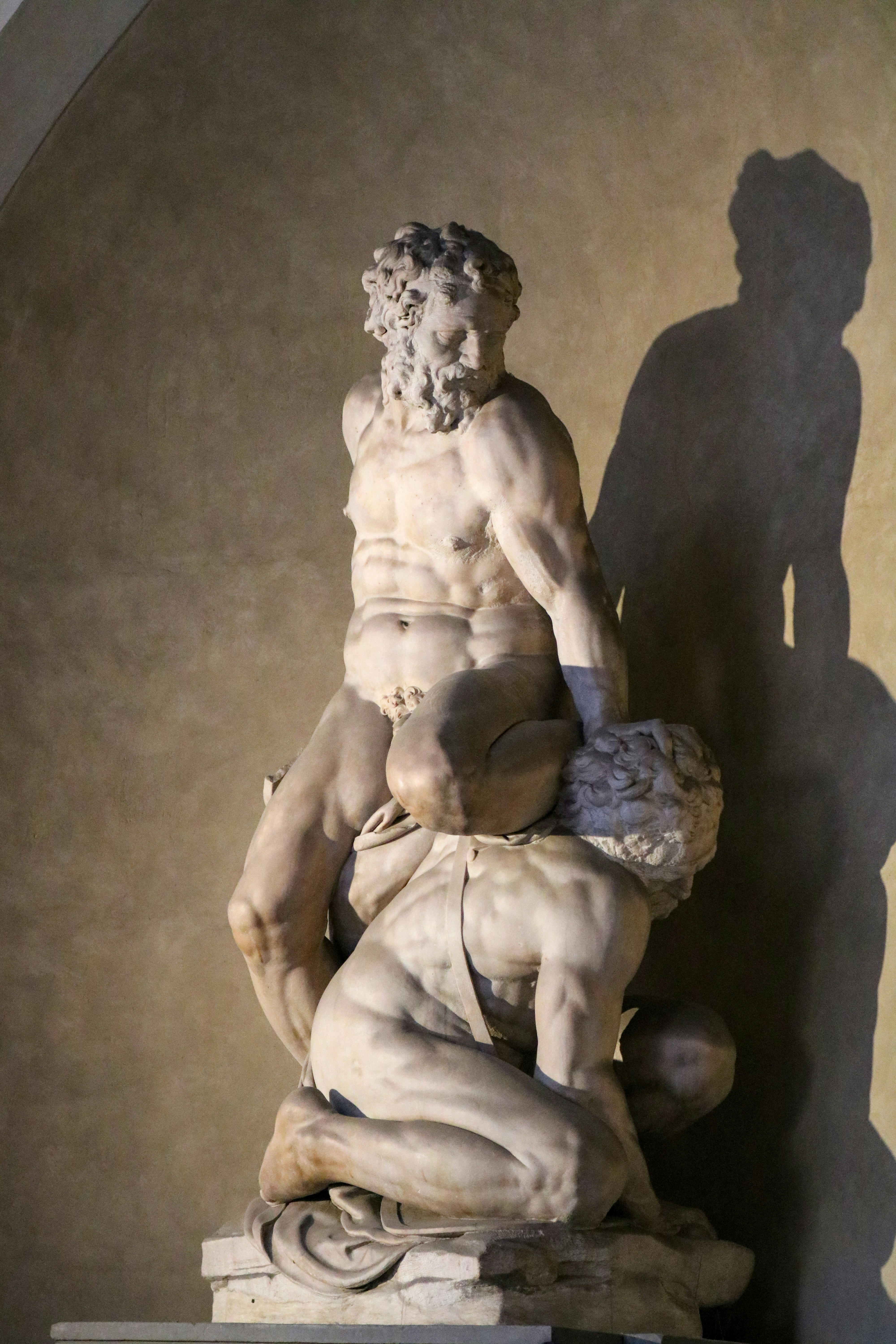 Statue in Tuscan Light: A Carved Torso in Quiet Shadow
