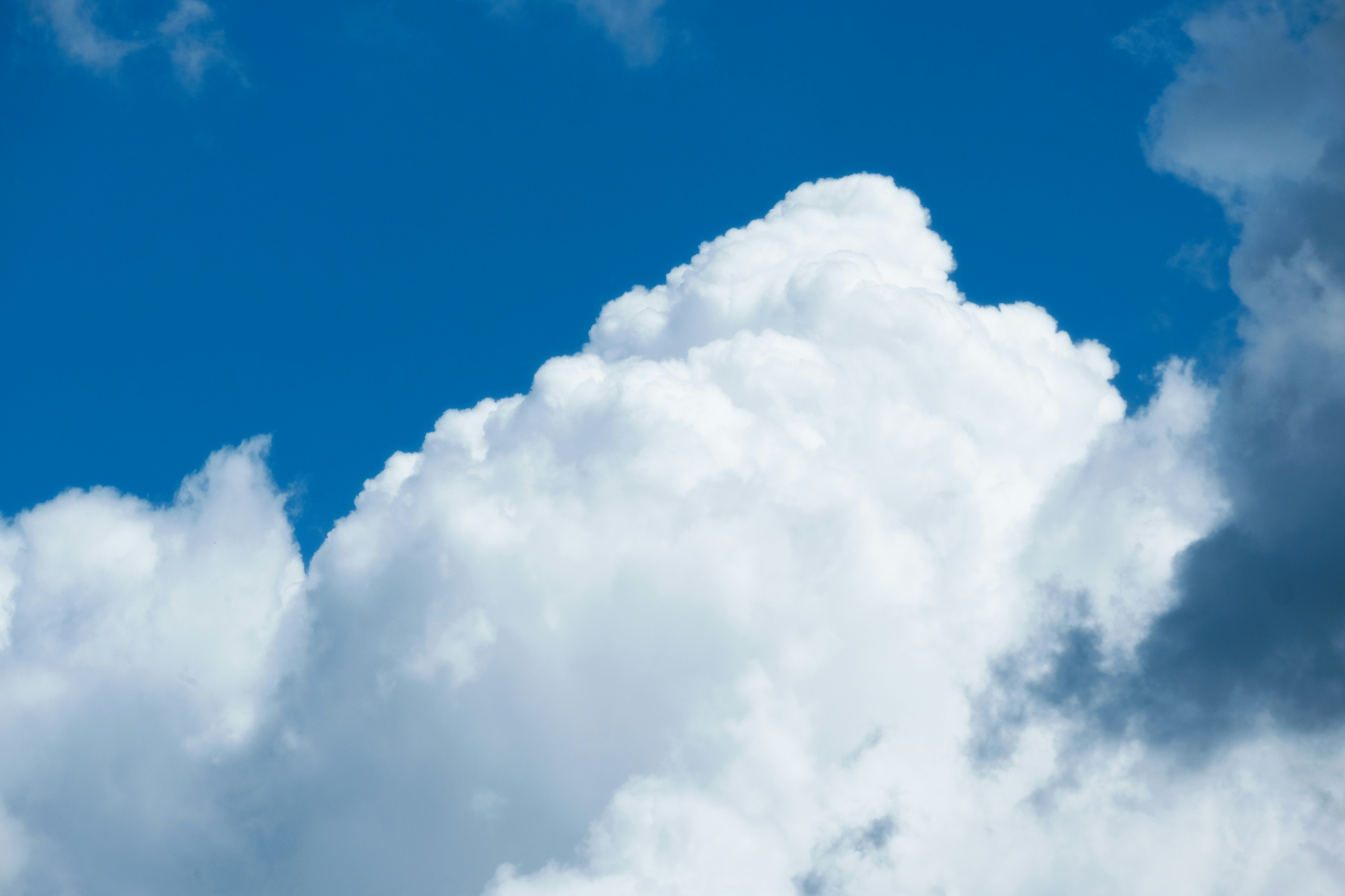 Twin-Cloud Summit on a Clear Azure Field