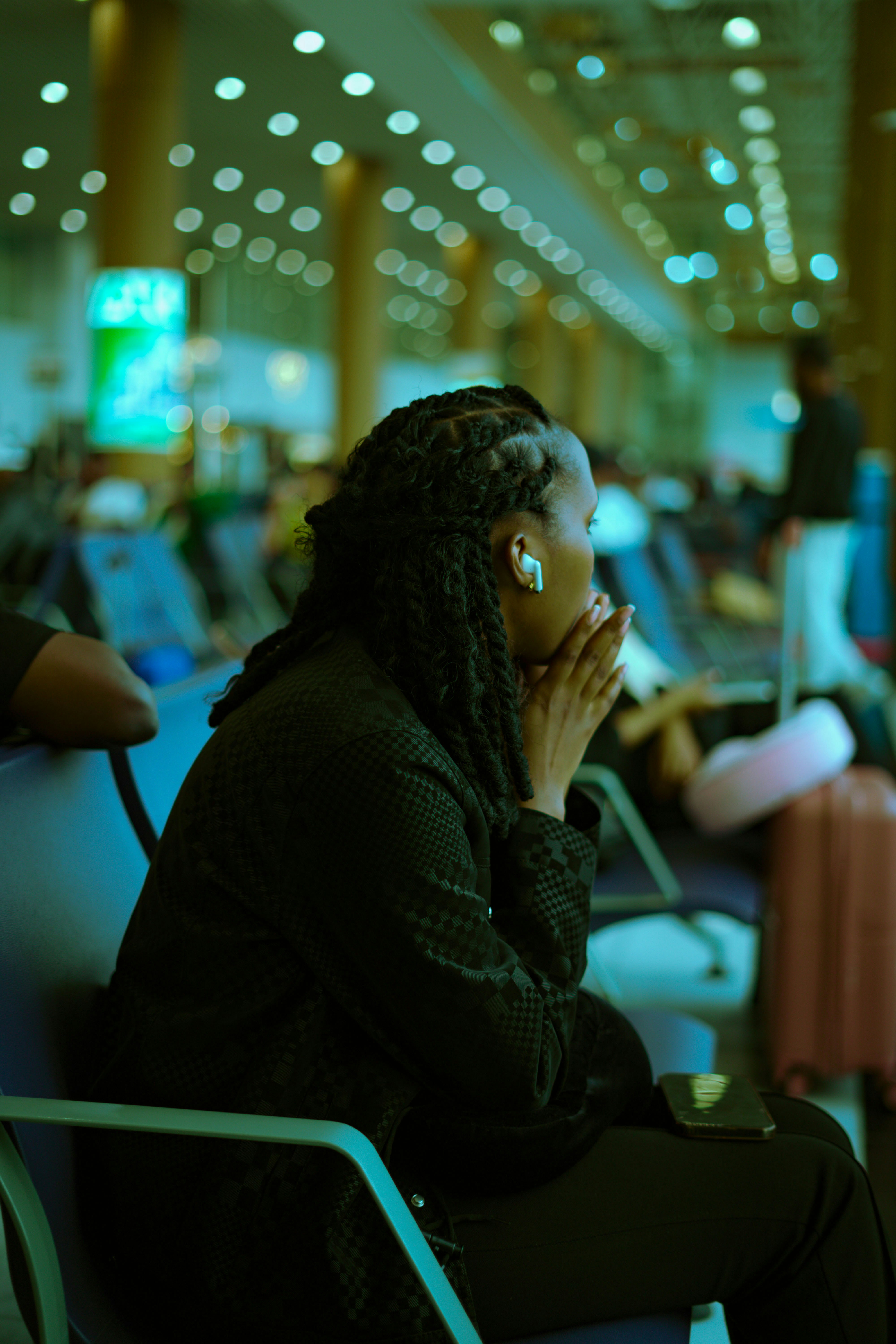 Quiet Contemplation in a Sea of Green Lights