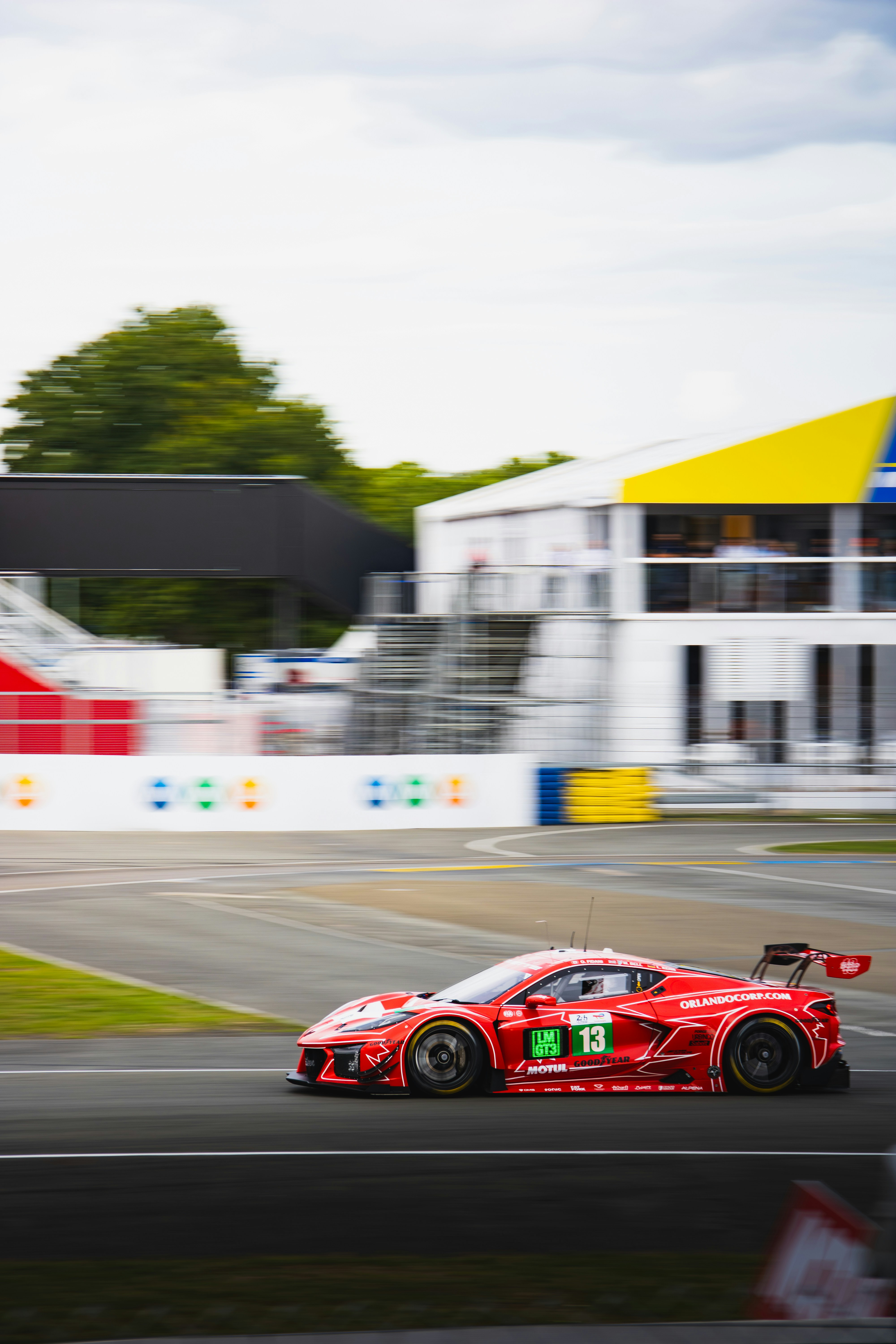 Red Racer in Focus: A Lively Sprint Around the Circuit