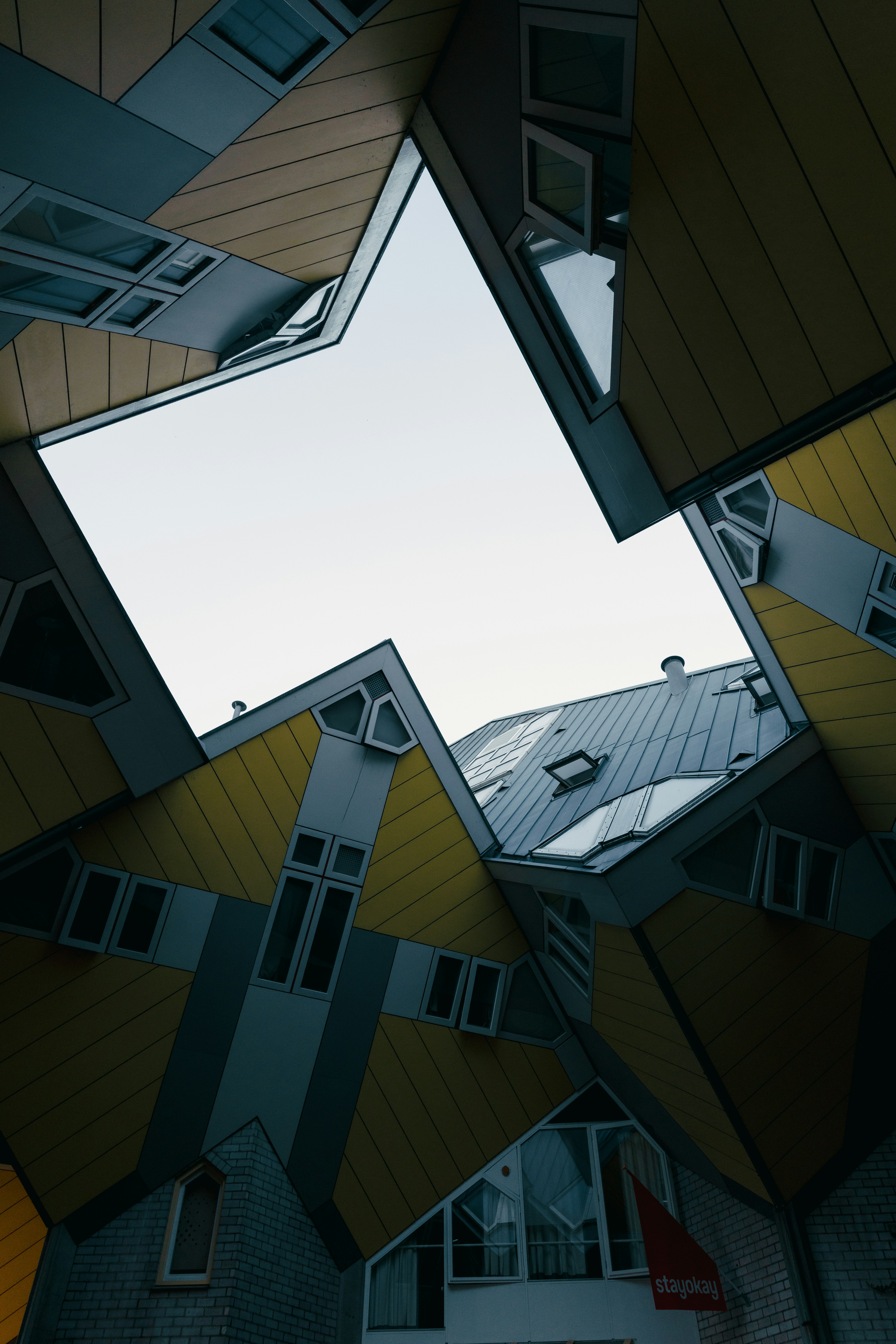 Skyward Courtyard: A Kaleidoscope of Geometric Facades