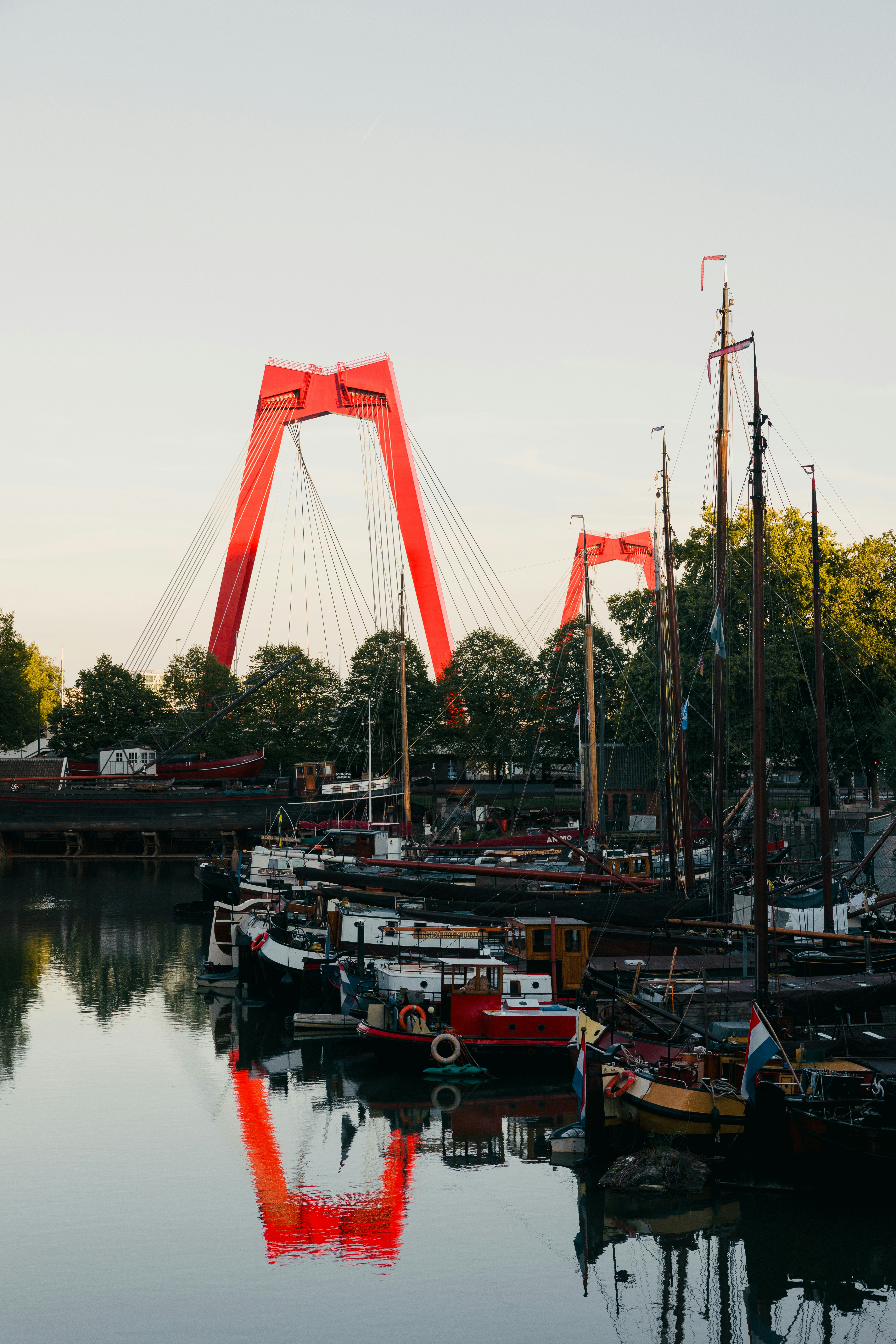 Red Span in the Docks: A Sunset Overhang and Charted Reflections