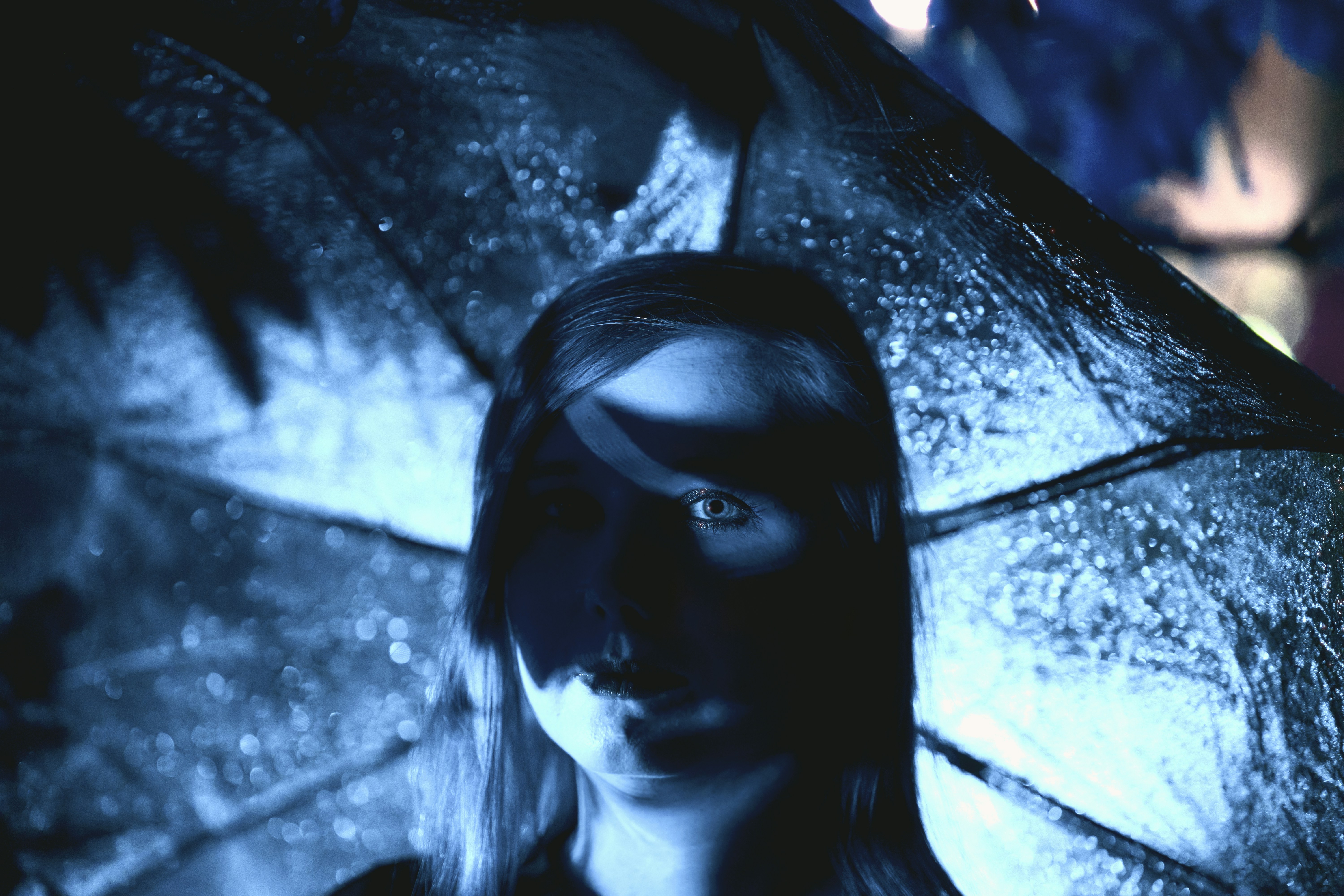 Blue Hour Veil: A Subtle Portrait Under Neon Rain