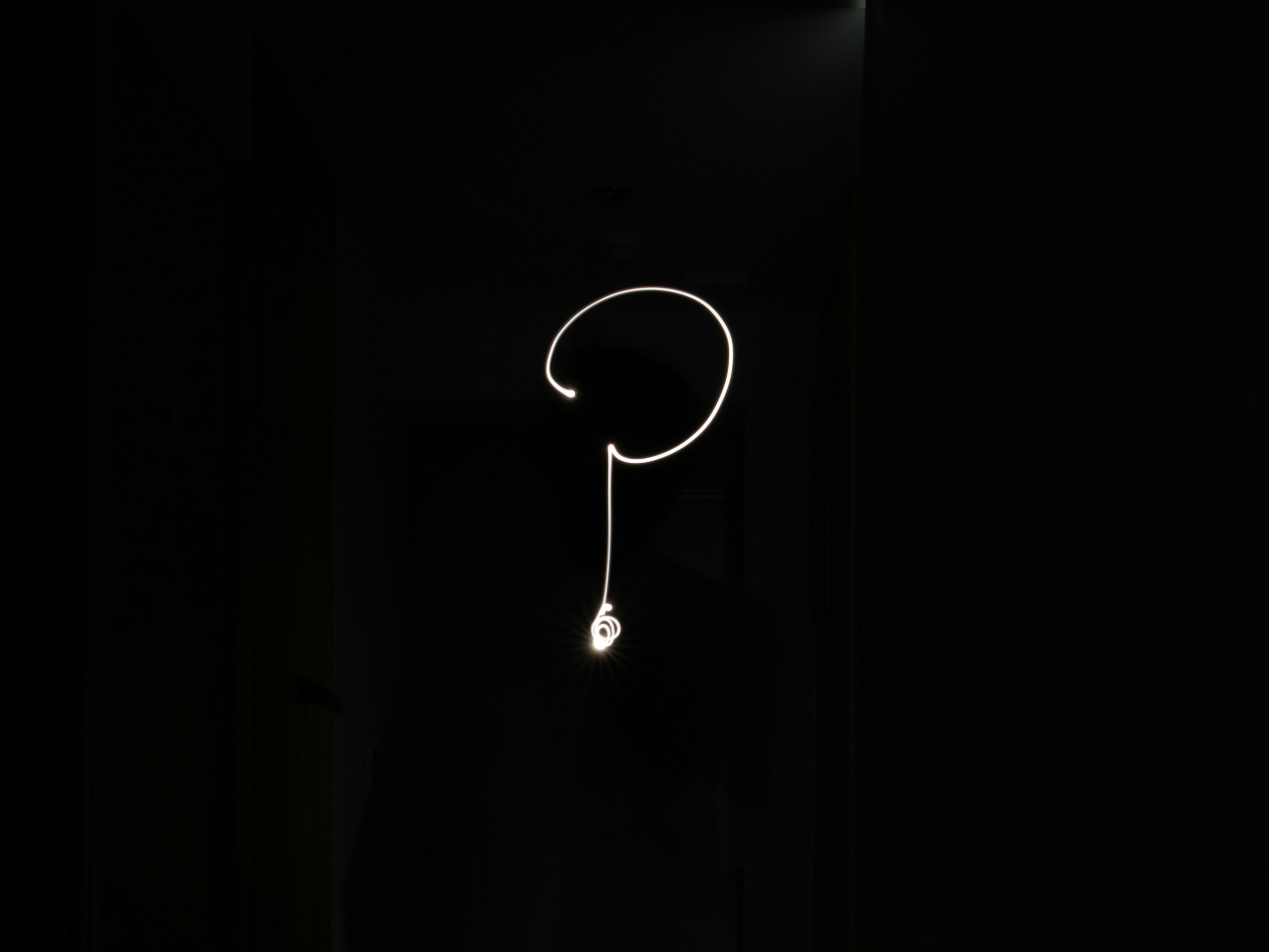 A Neon Question Mark in the Dark