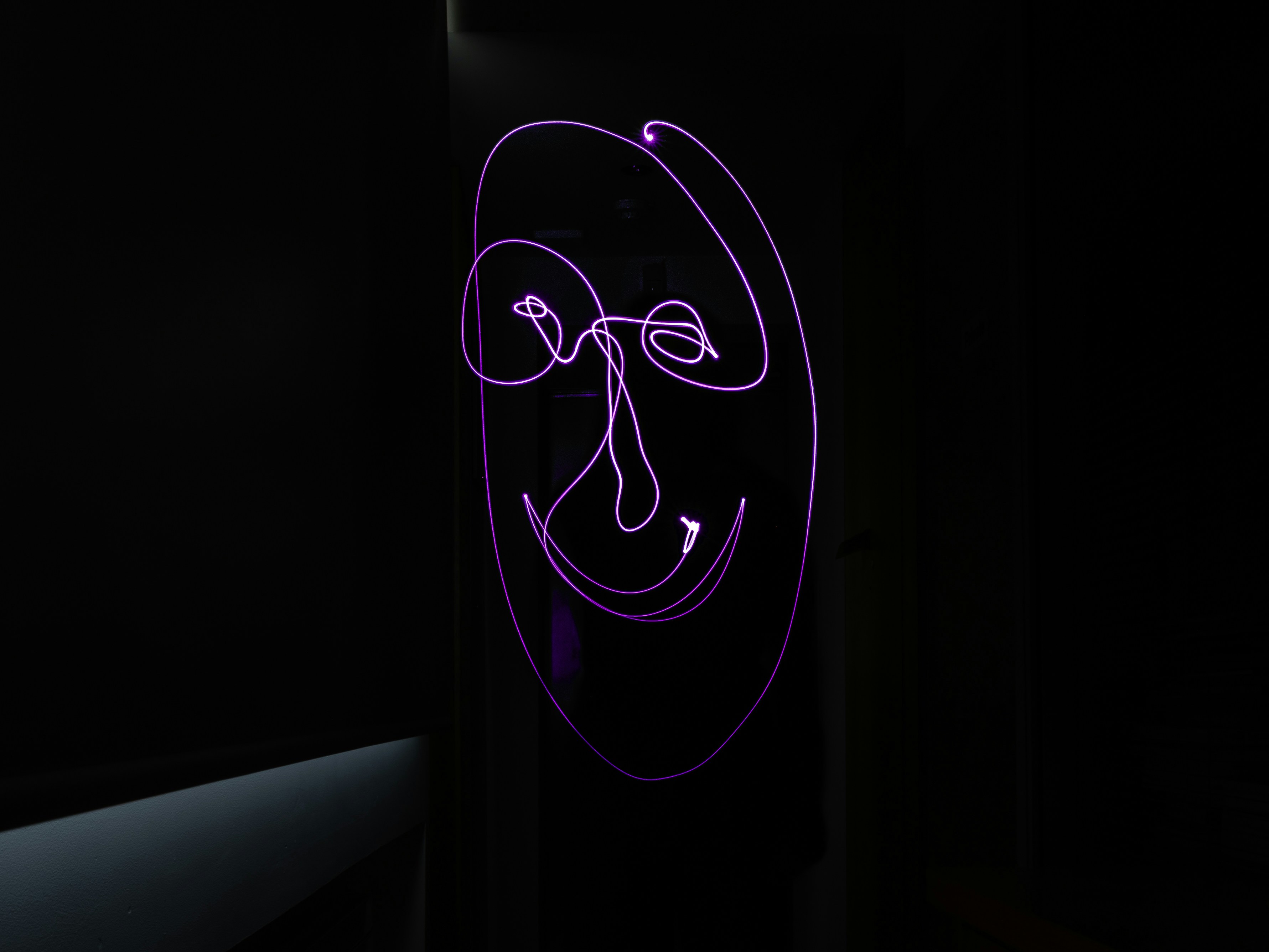 Neon Portrait in a Velvet Dark: A Single Line of Light