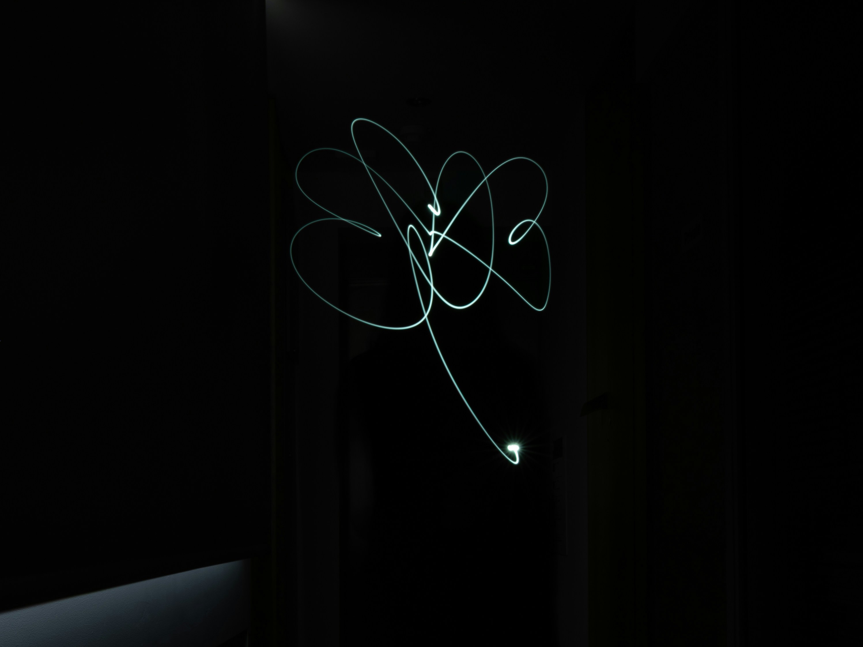 Neon Whirl: A Lone Light Script Across Dark Space
