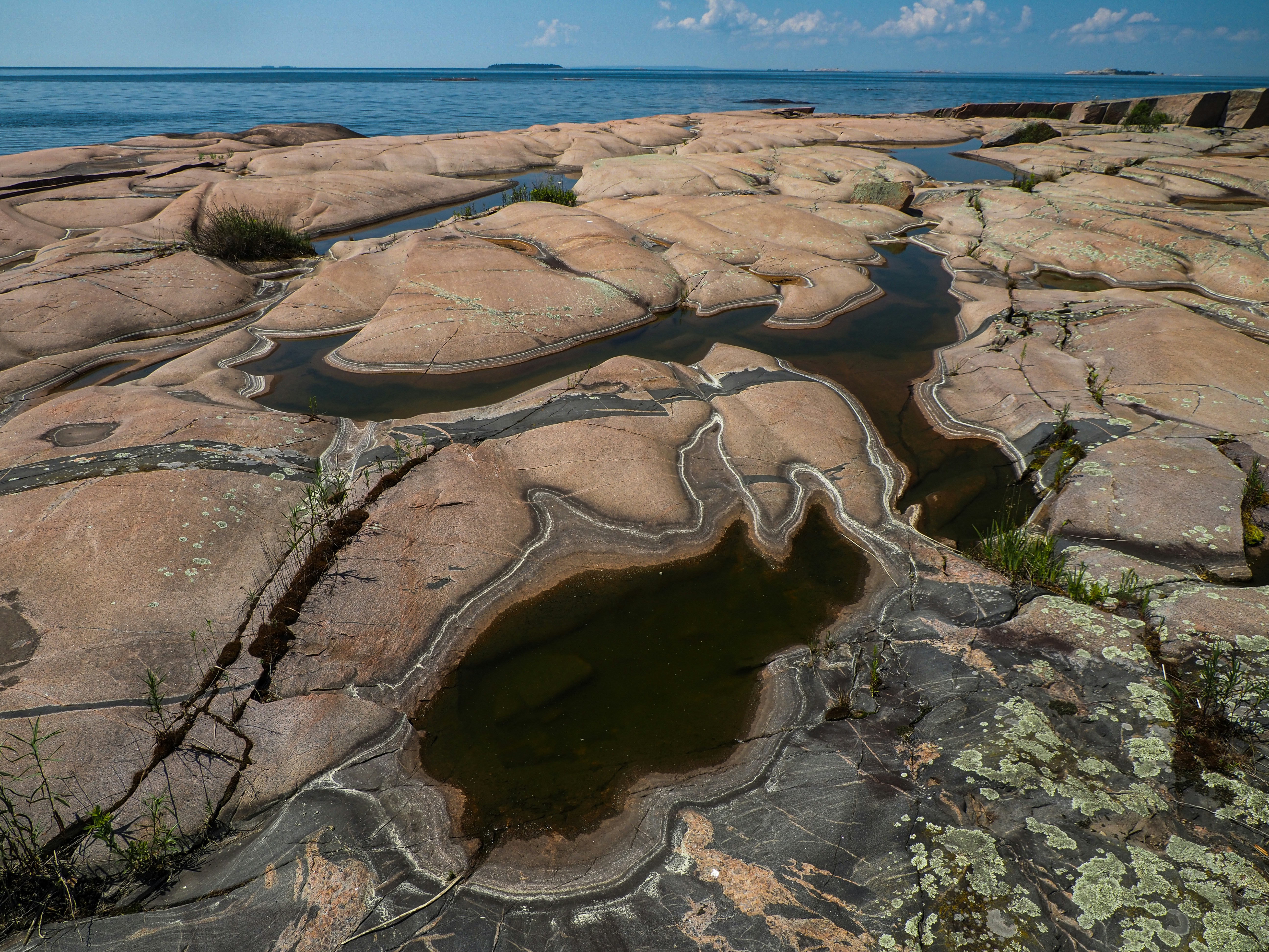 Rippled Granite Islands Meet the Ocean's Edge