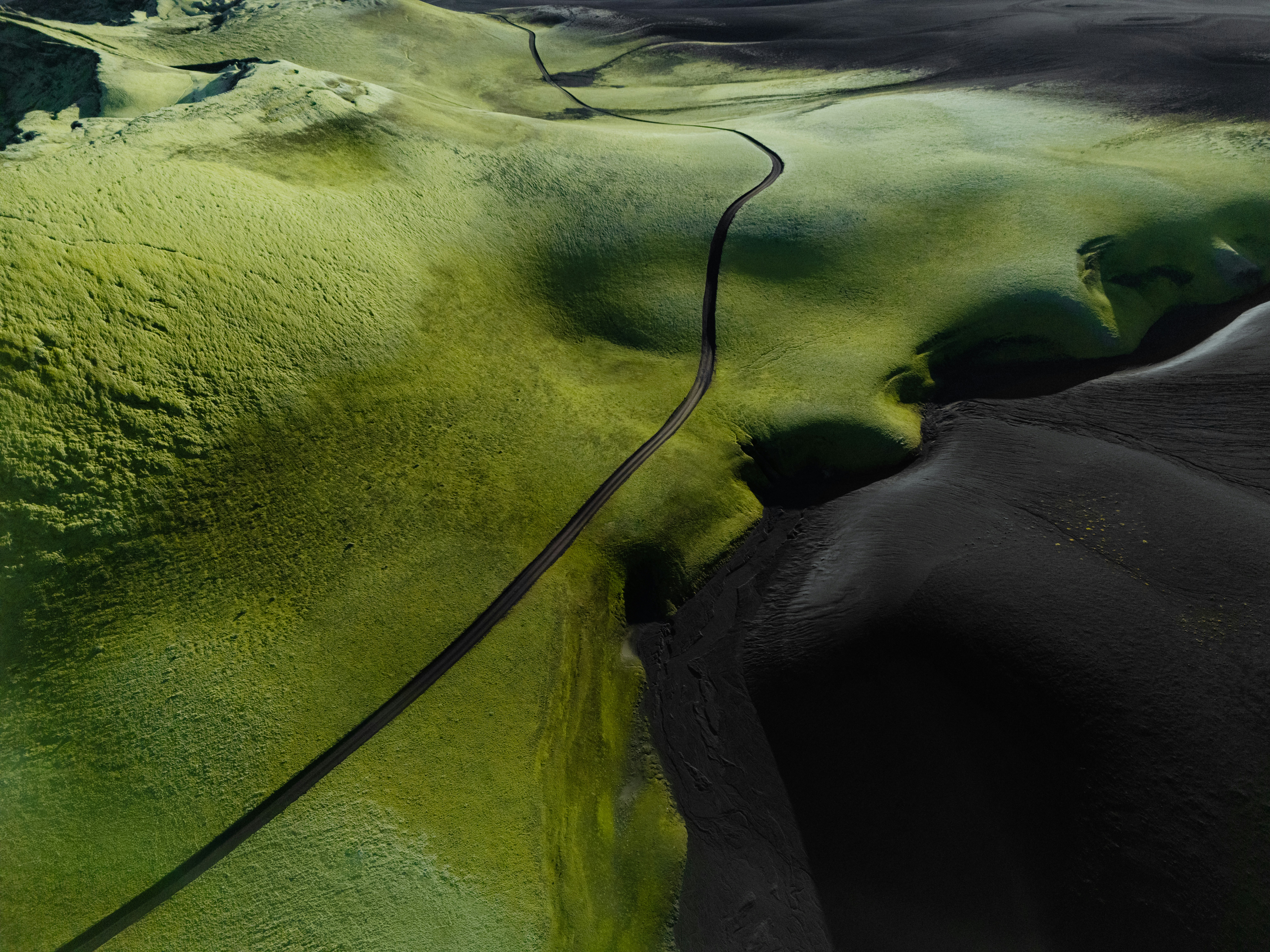 Verdant Ridge: A Winding Road Carves Through Lunar Valleys