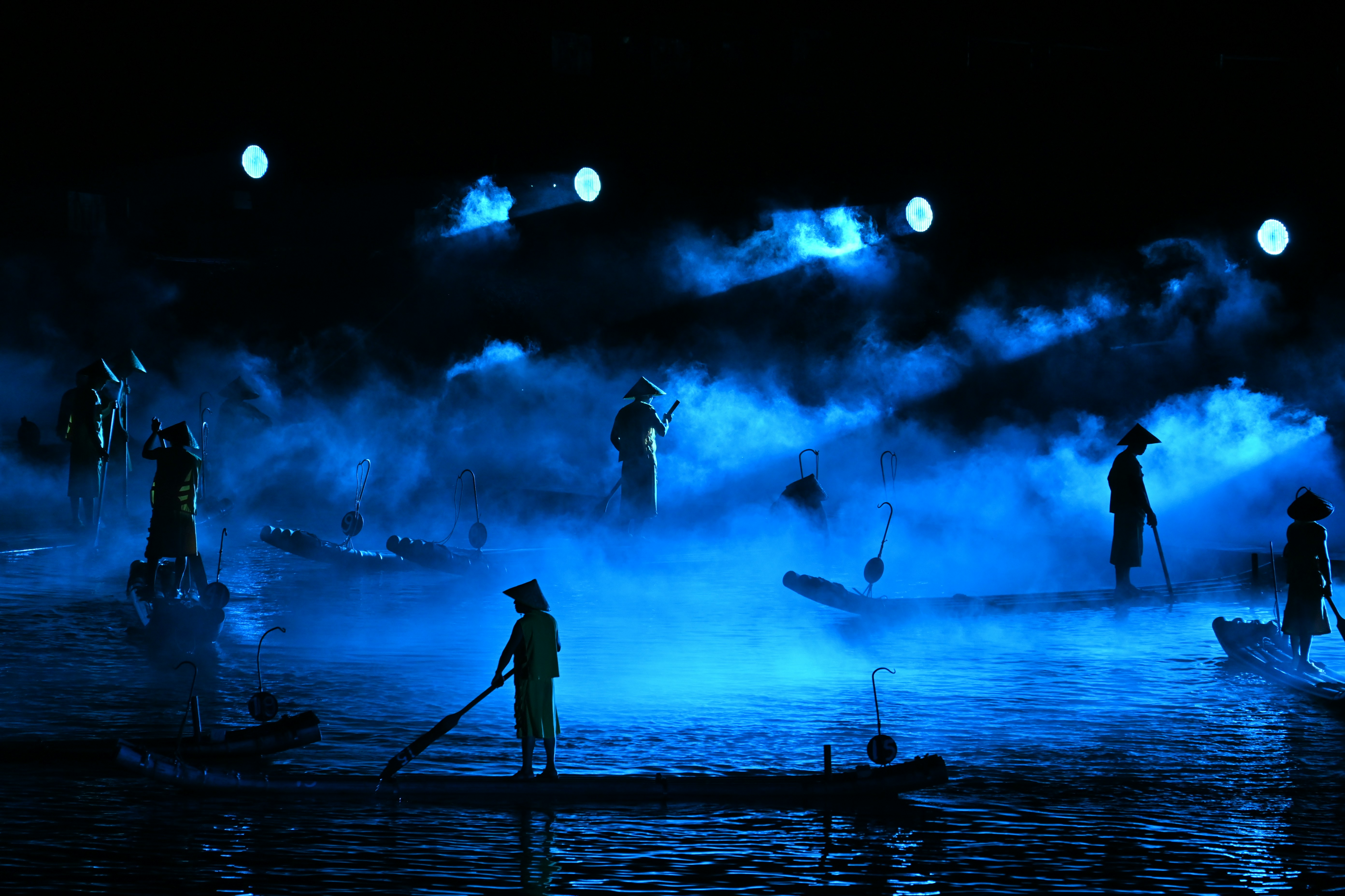 Silhouettes on a Misty River: A Night of Steam and Spectral Light