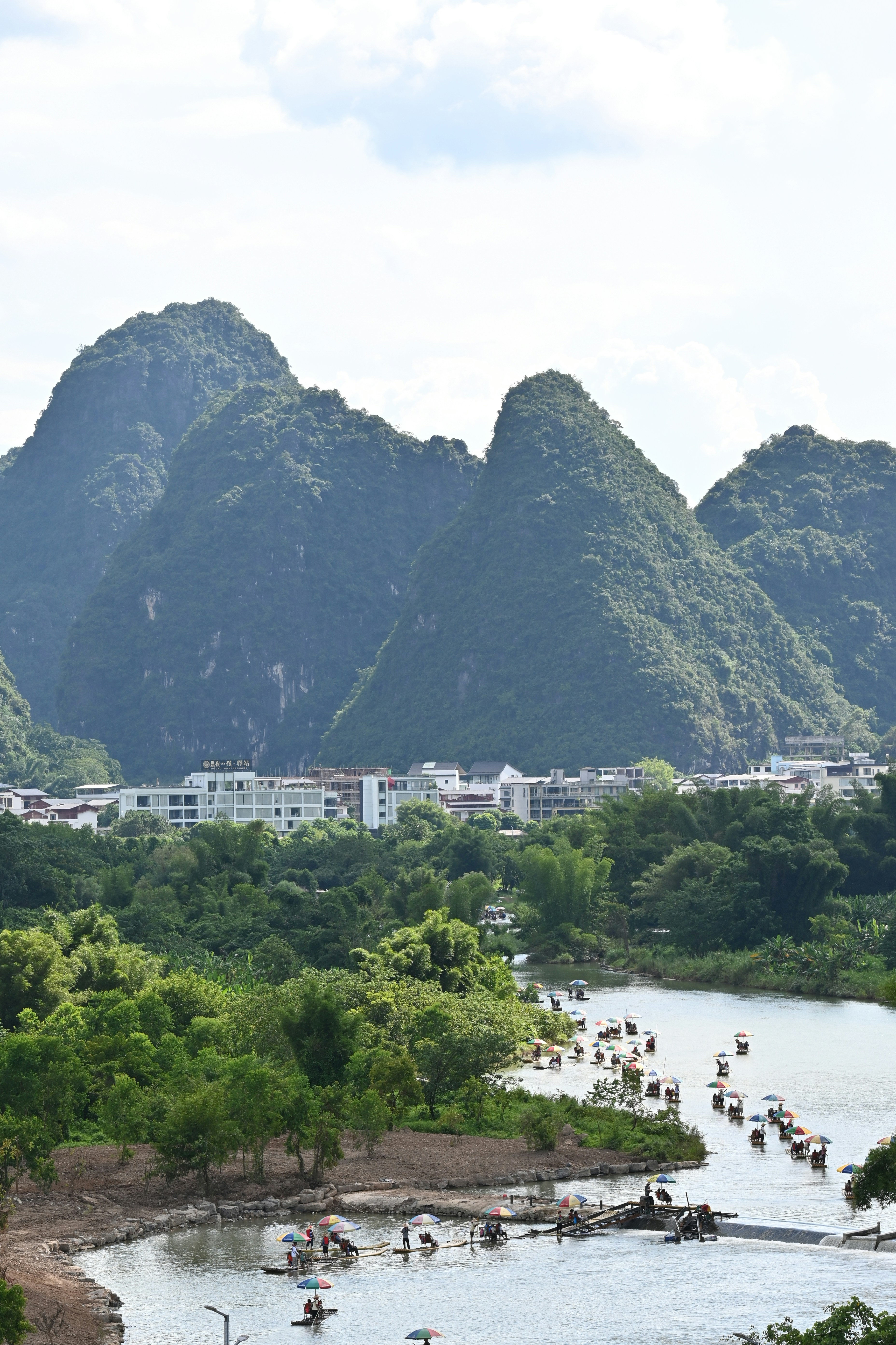 Riverside Village Nestled at the Foot of Karst Peaks