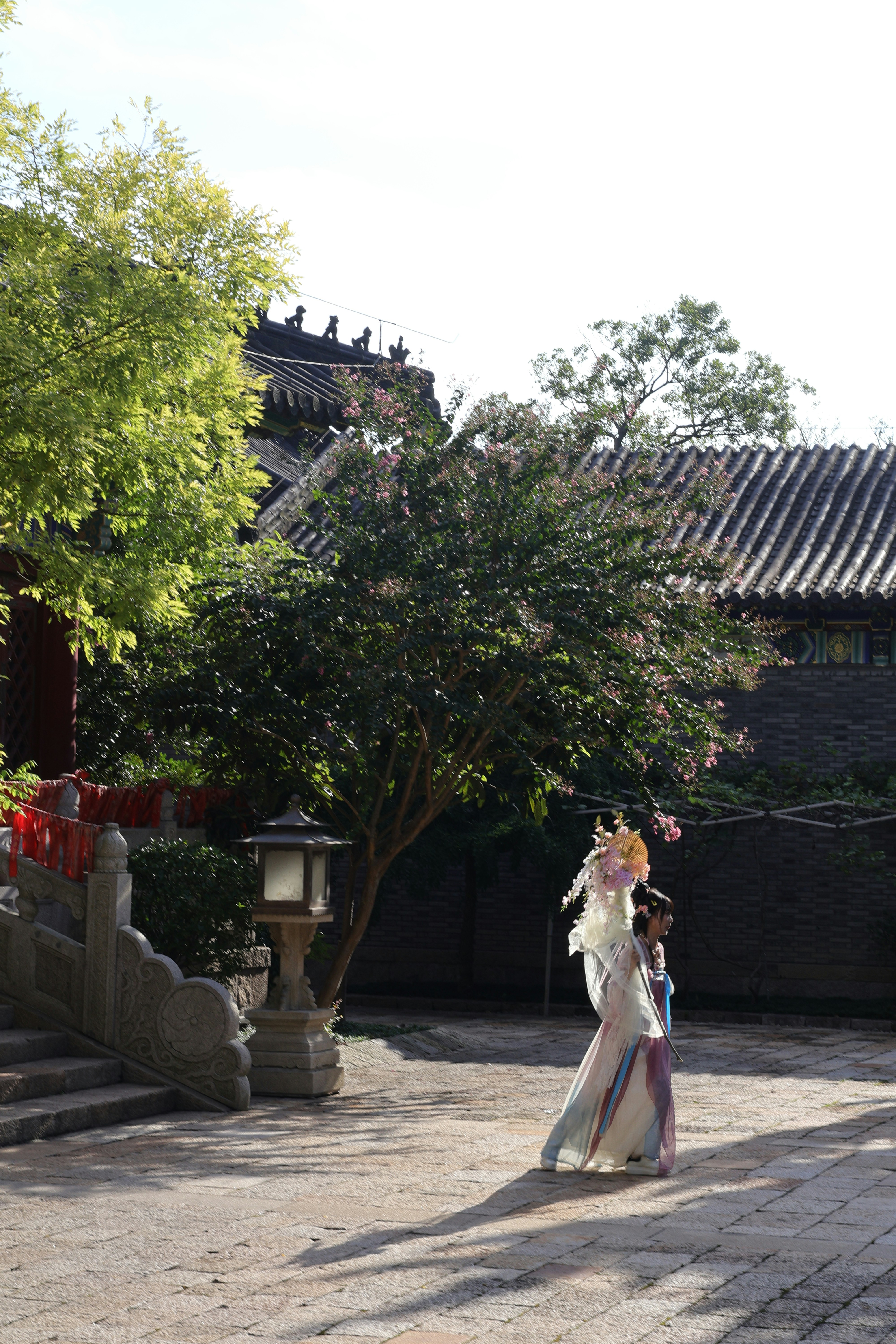 Bride in Elegant Hanfu Beneath Ancient Roofs