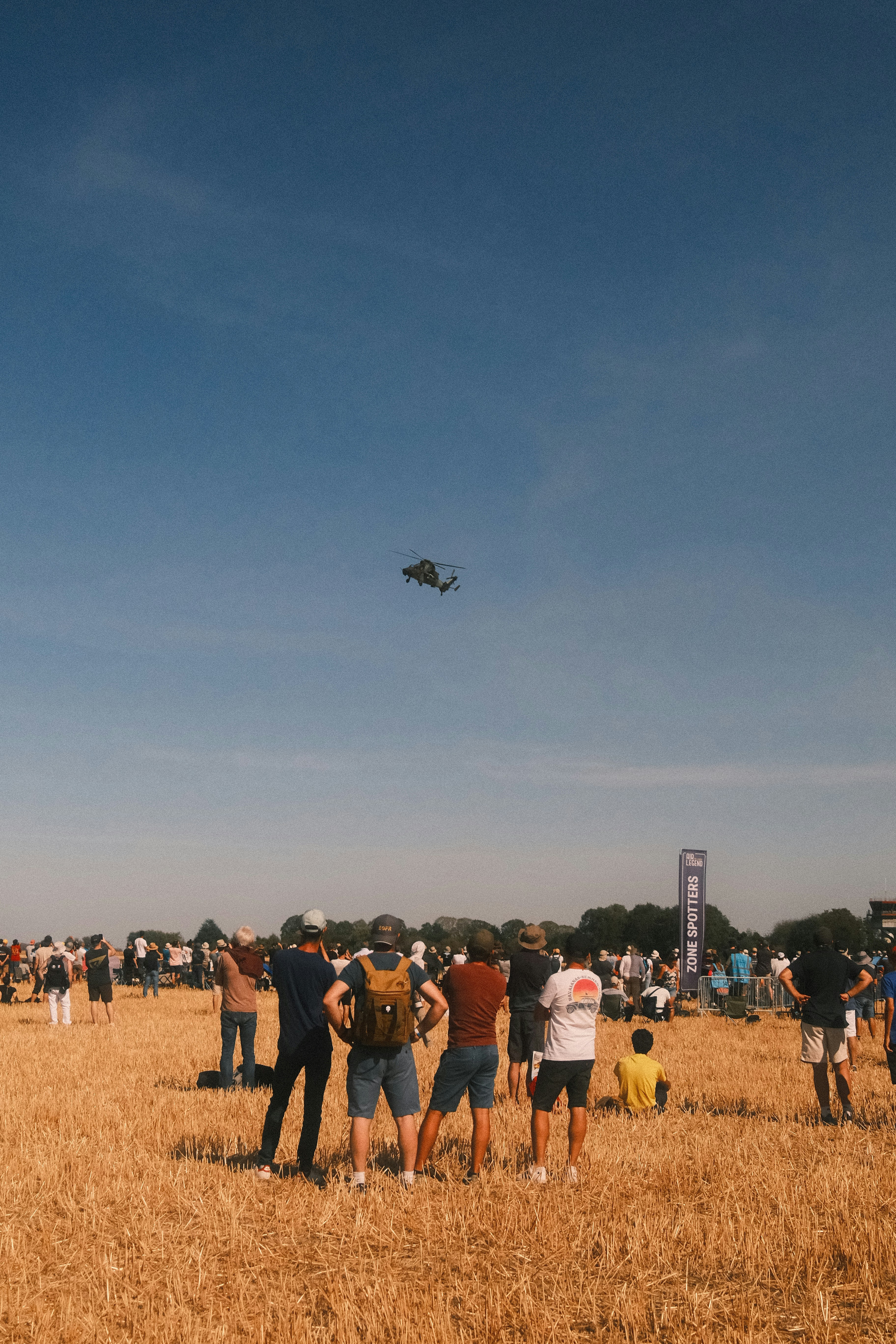 Midair Helix: A Helipad Spectacle over a Crowd at Field Day