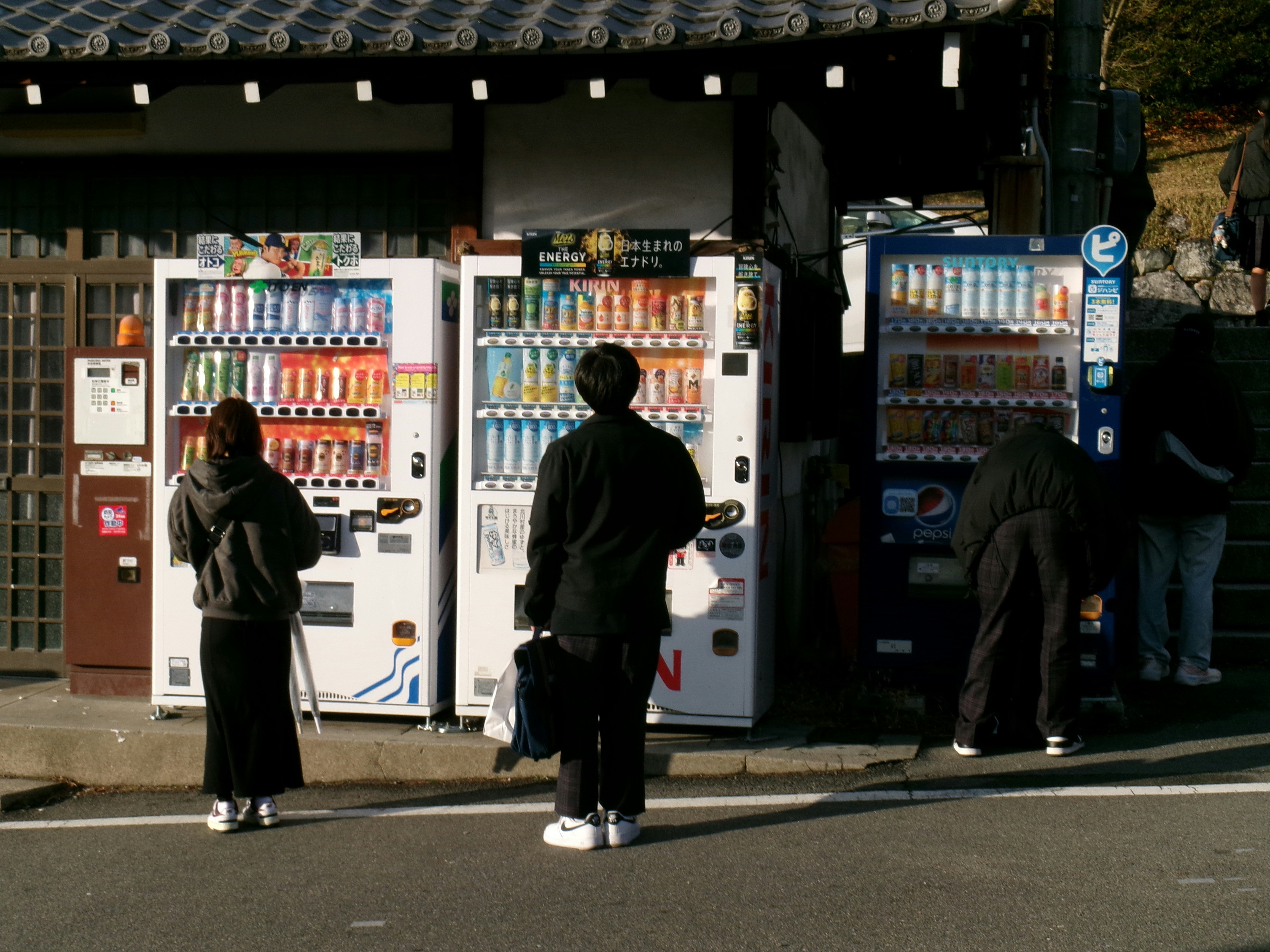 Soda Vending Row at a Quiet Station Entrance