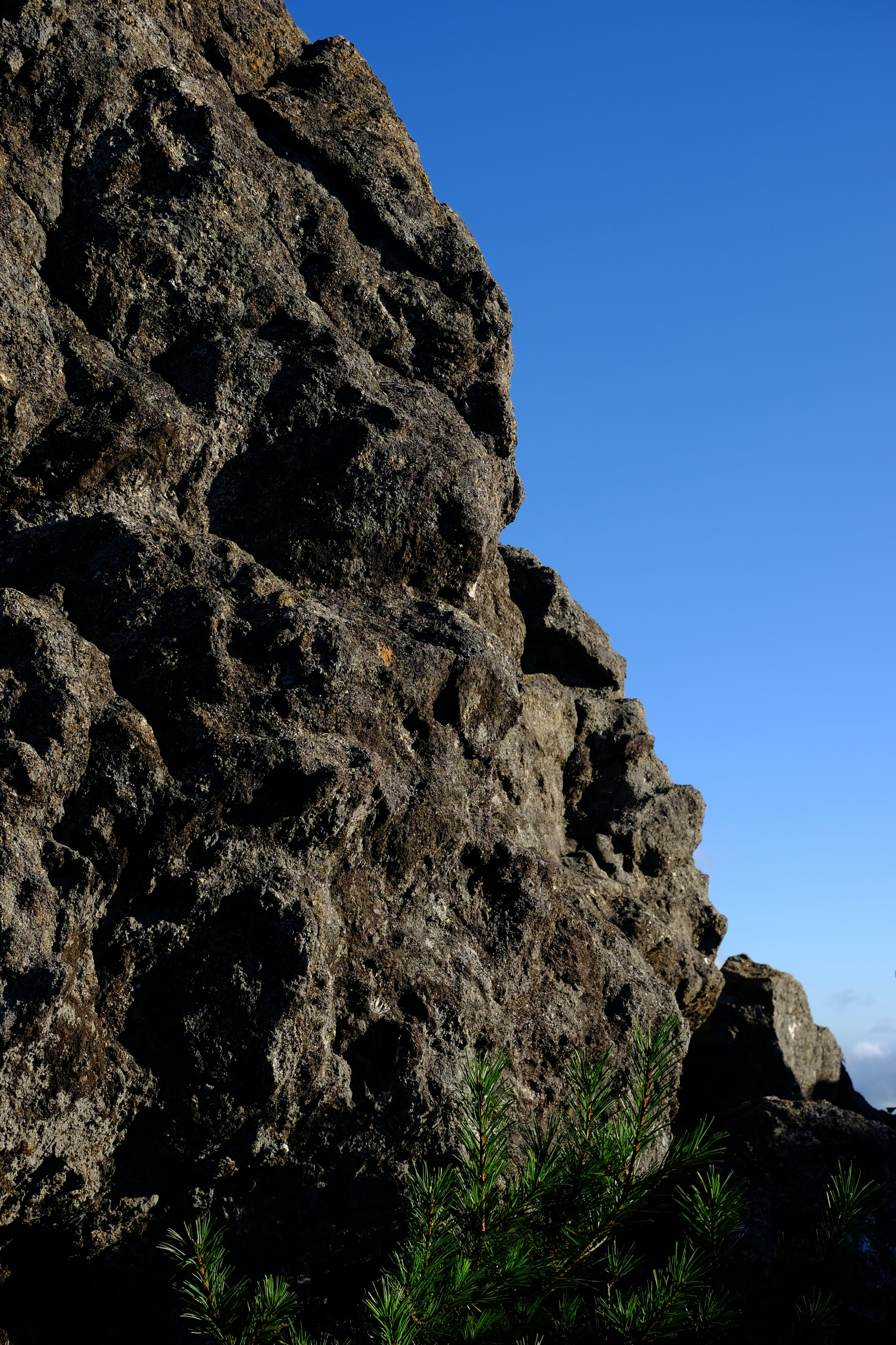 Harsh Cliffs and Bright Sky: A Coastal Rock Face