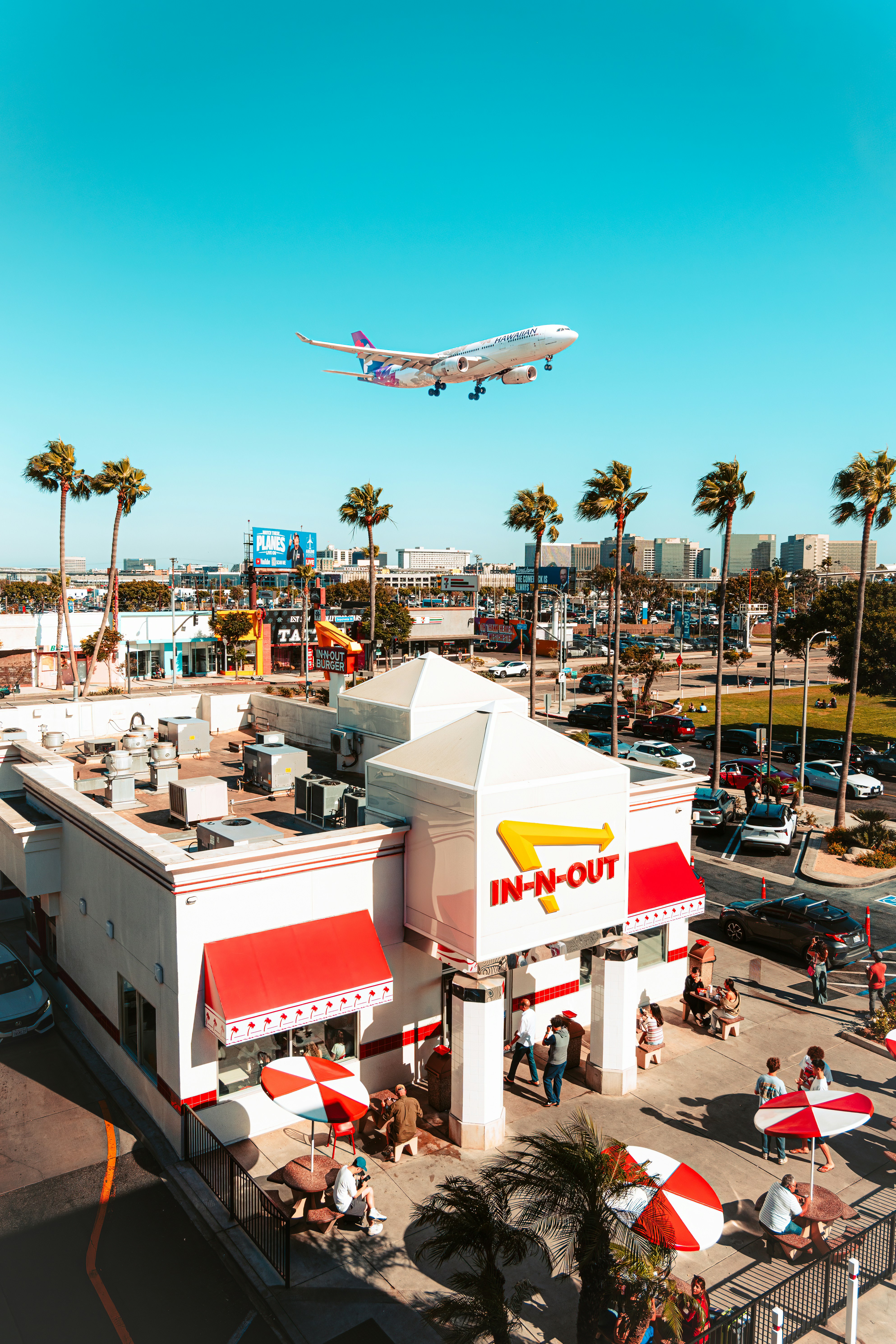 Hawaiian Airbus A330 landing at LAX over In-N-Out.