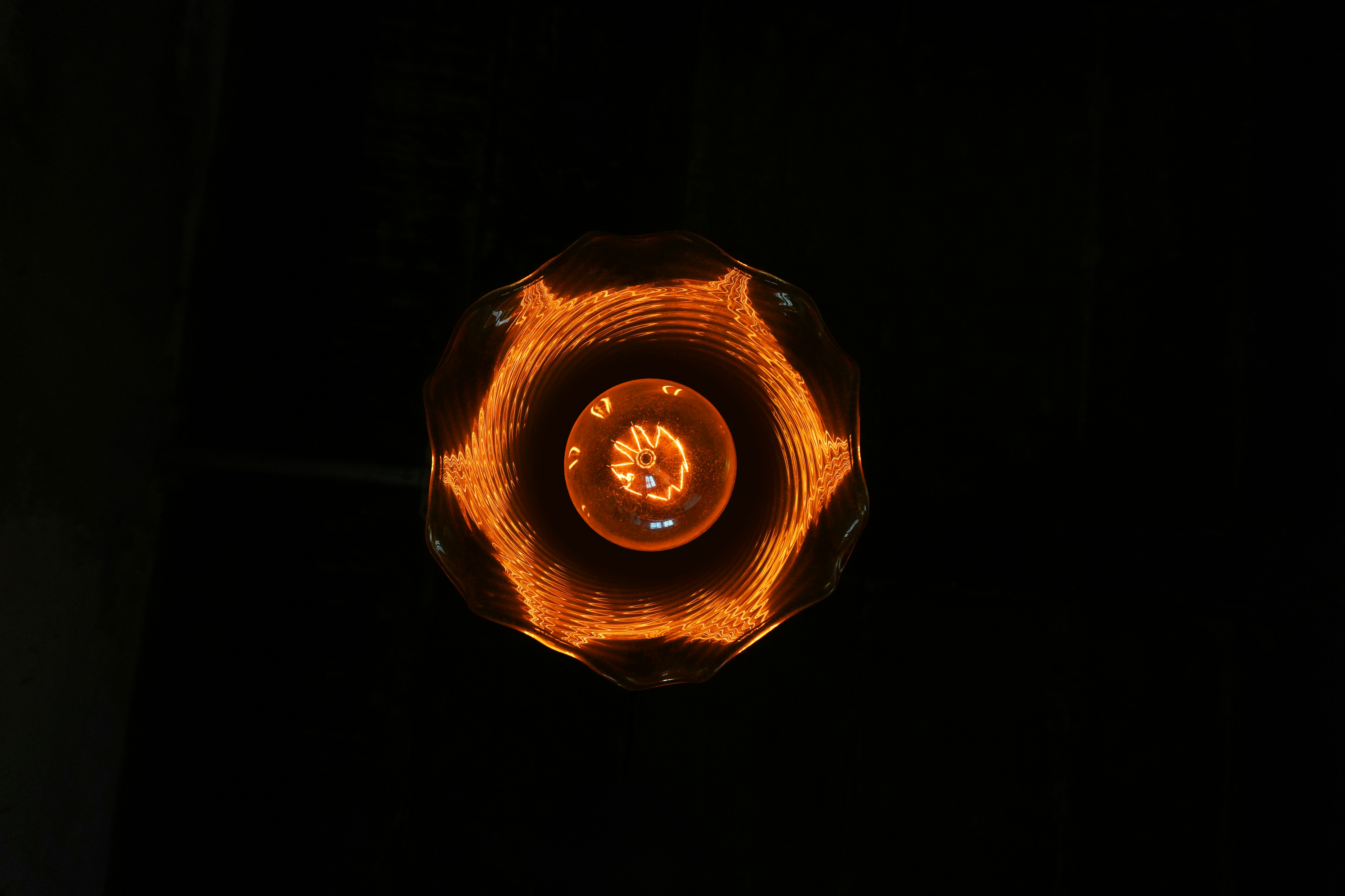 Luminous Orb: A solitary tungsten glow in a velvet-dark space