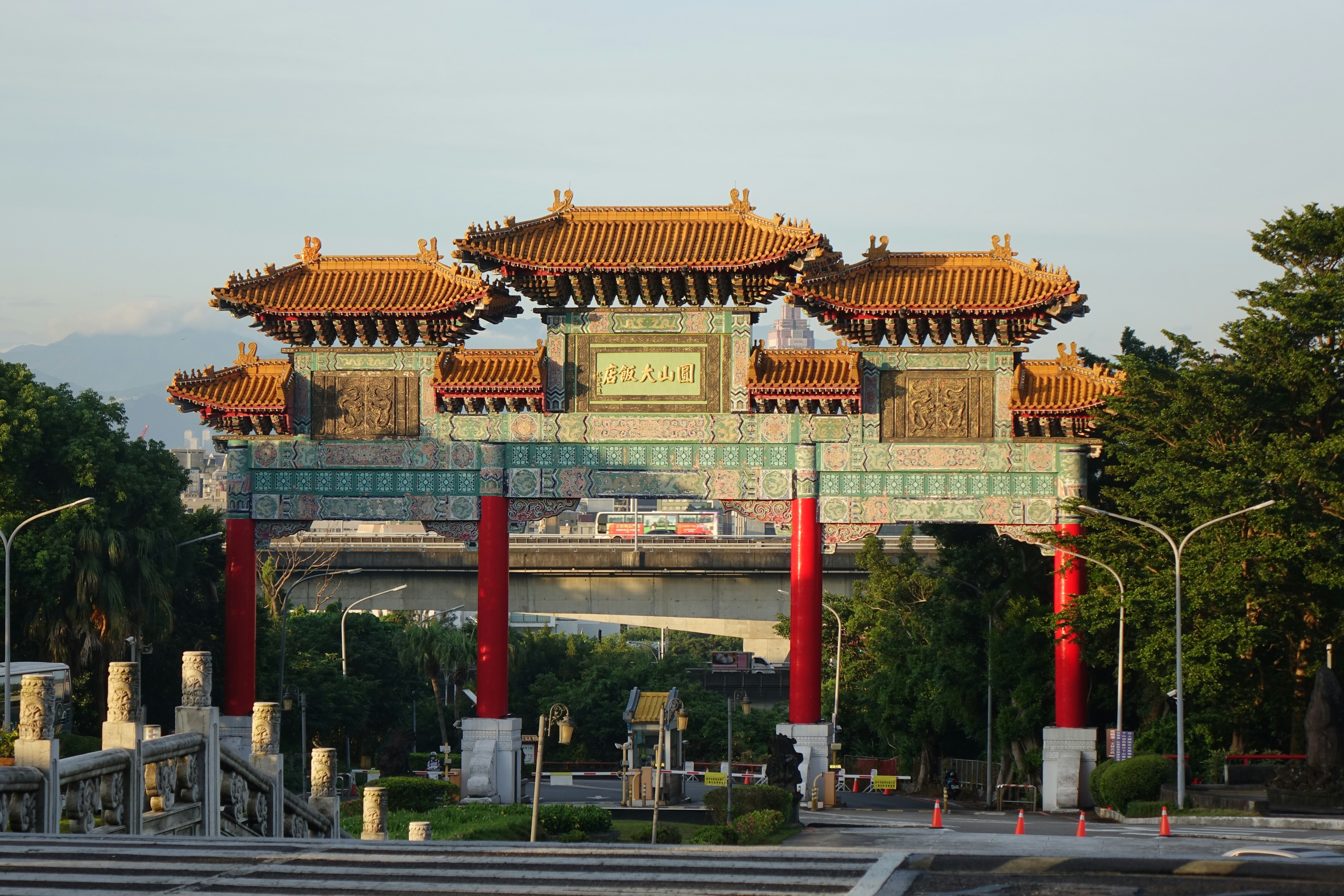 Temple Gate Rising over a Sunlit Avenue