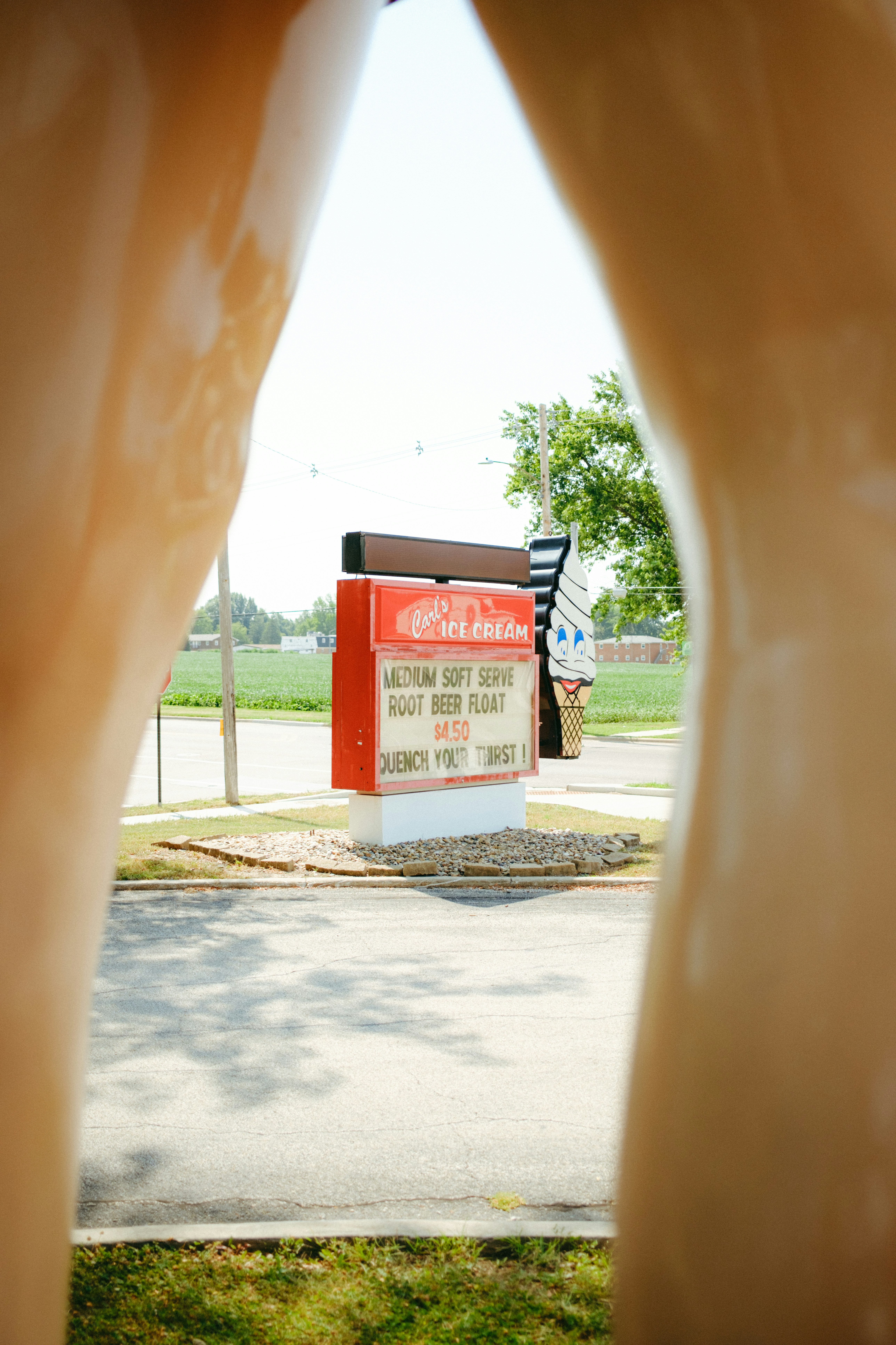 Ice Cream Sign Framed by a Playful Carved Opening