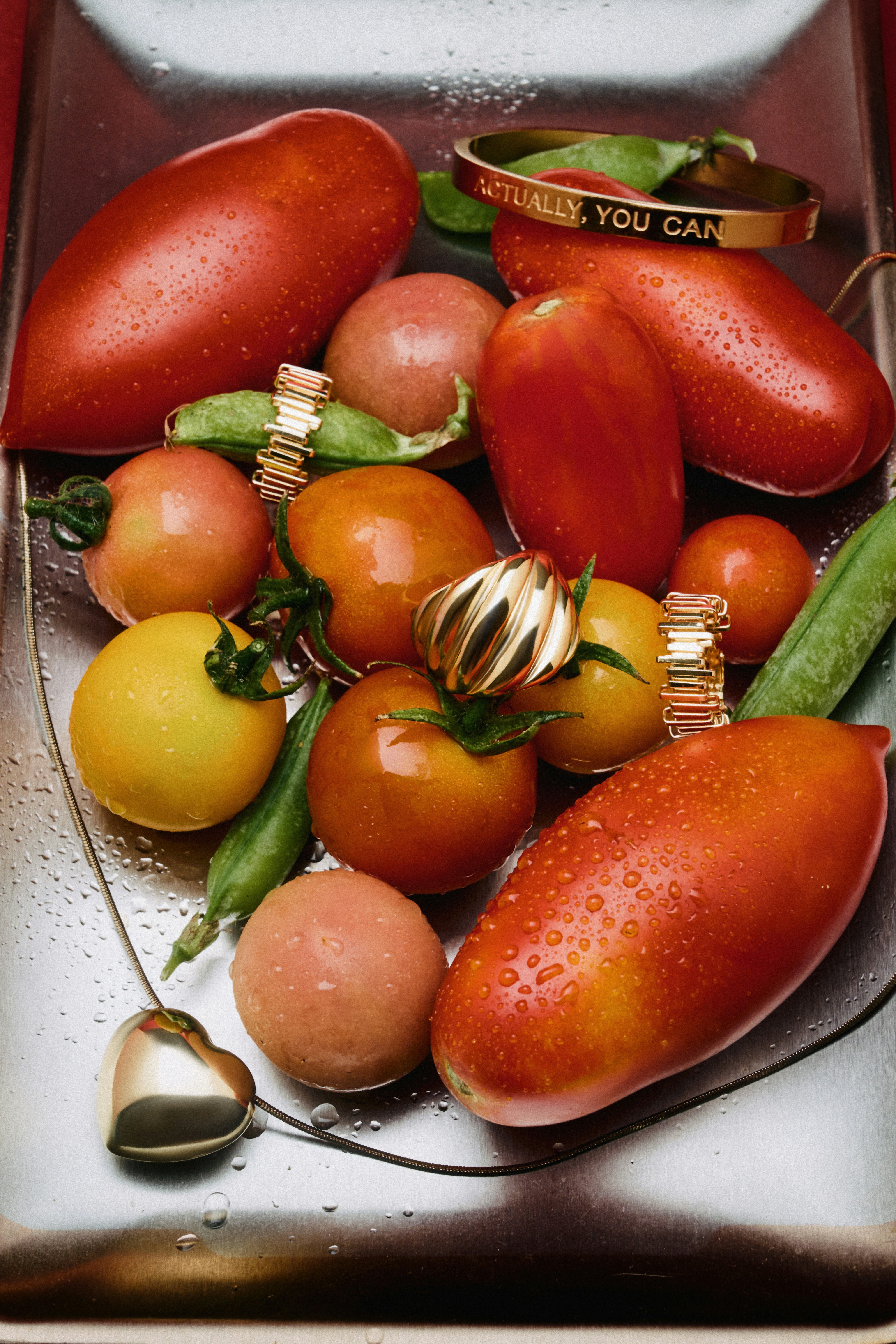 Golden Harvest in a Stainless Garden: Juicy Tomatoes and Shiny Ornaments