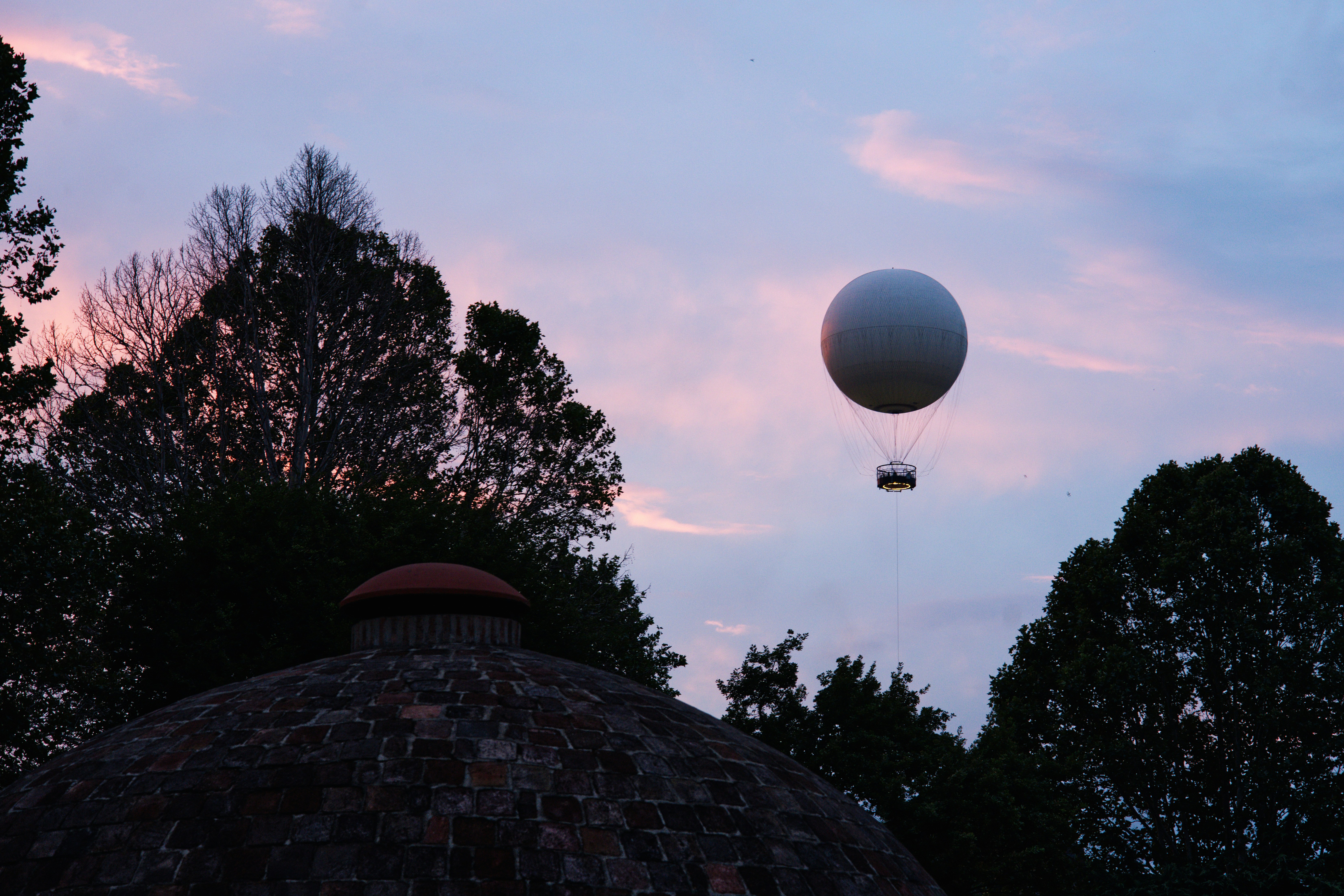 Dawn Balloon Over a Dome: Quiet Skyward Moment