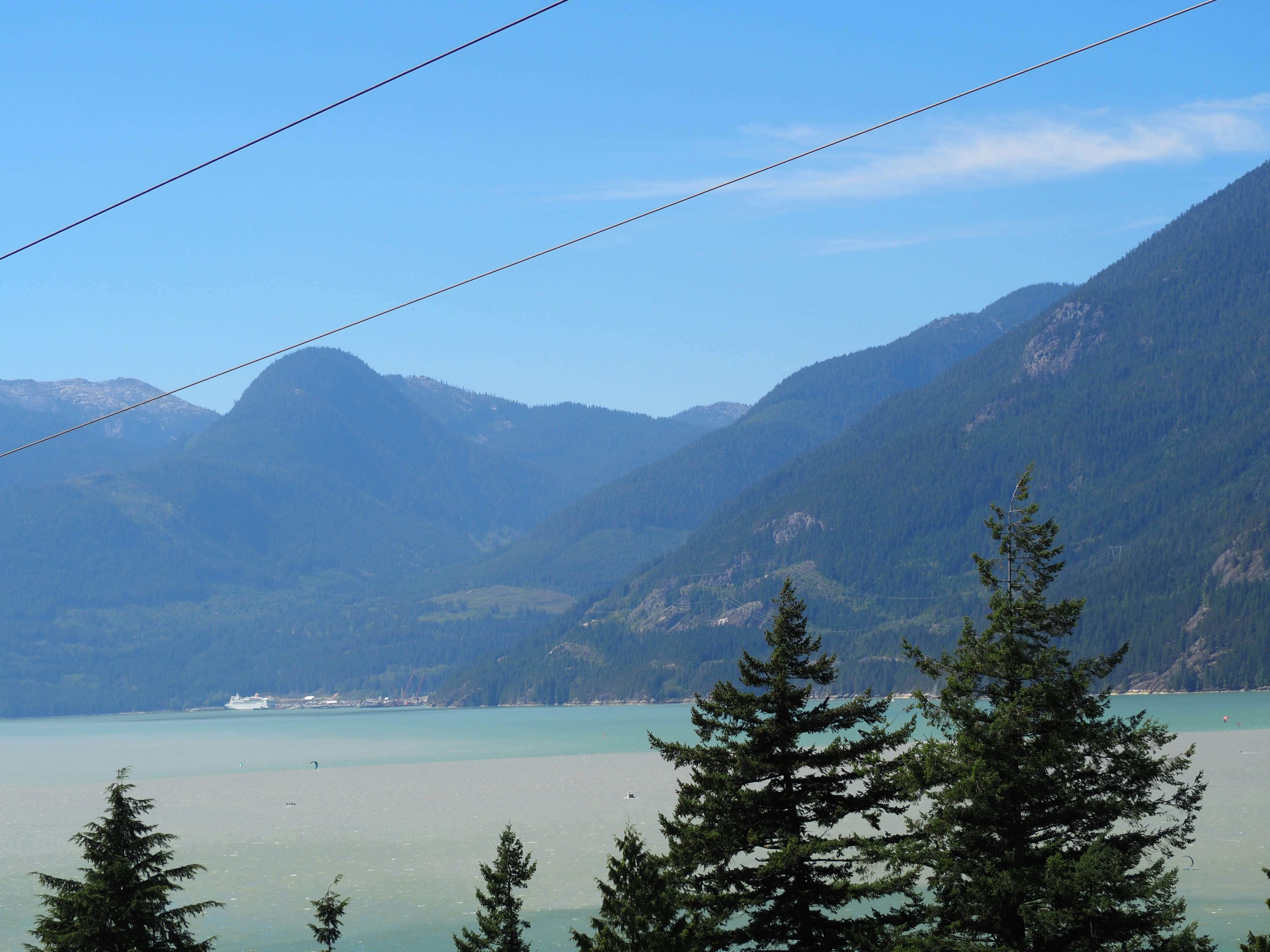Glacial Lake Vista Under Aerial Cables