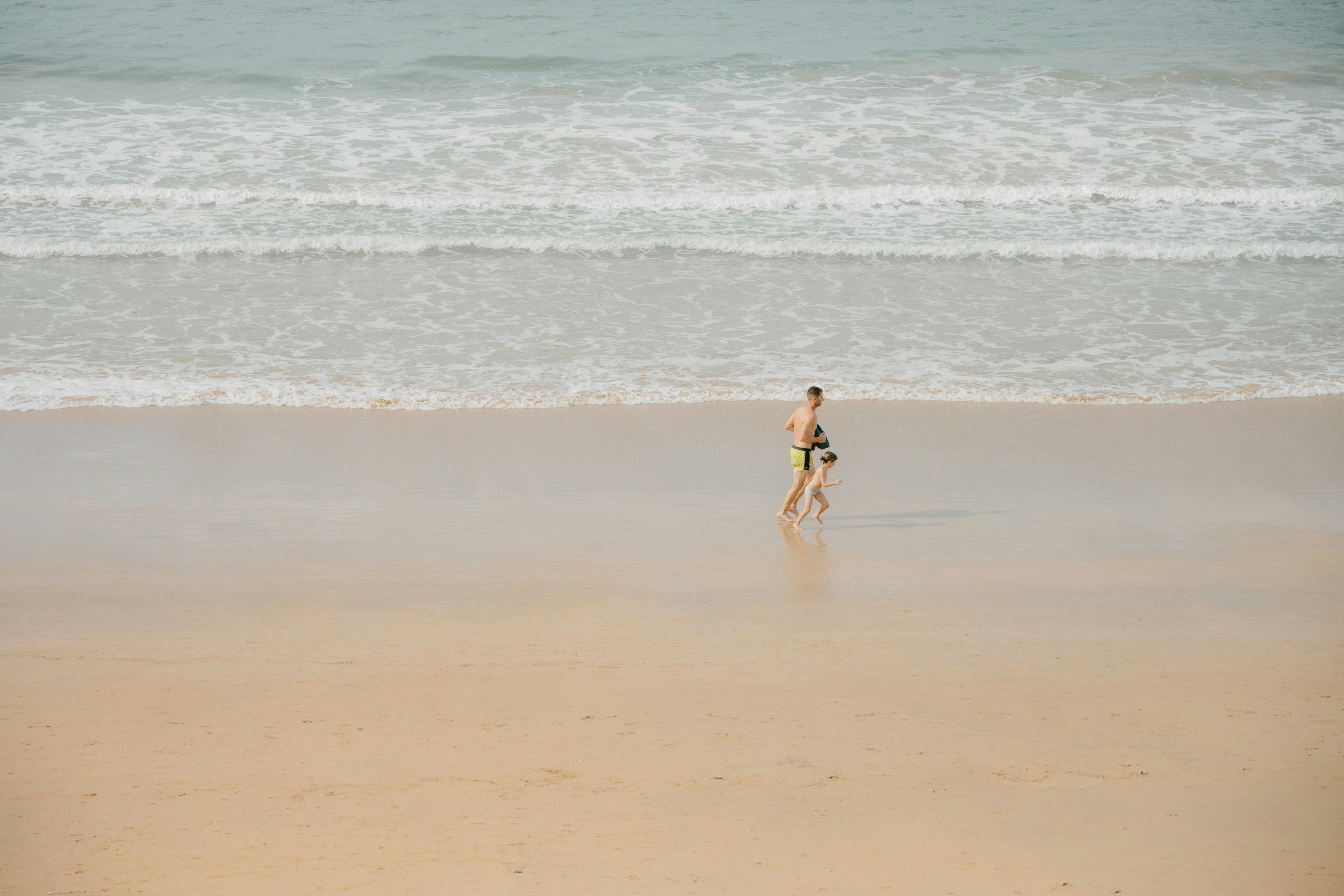 Solitary Strand Runner: A Quiet Moment at the Edge of the Sea