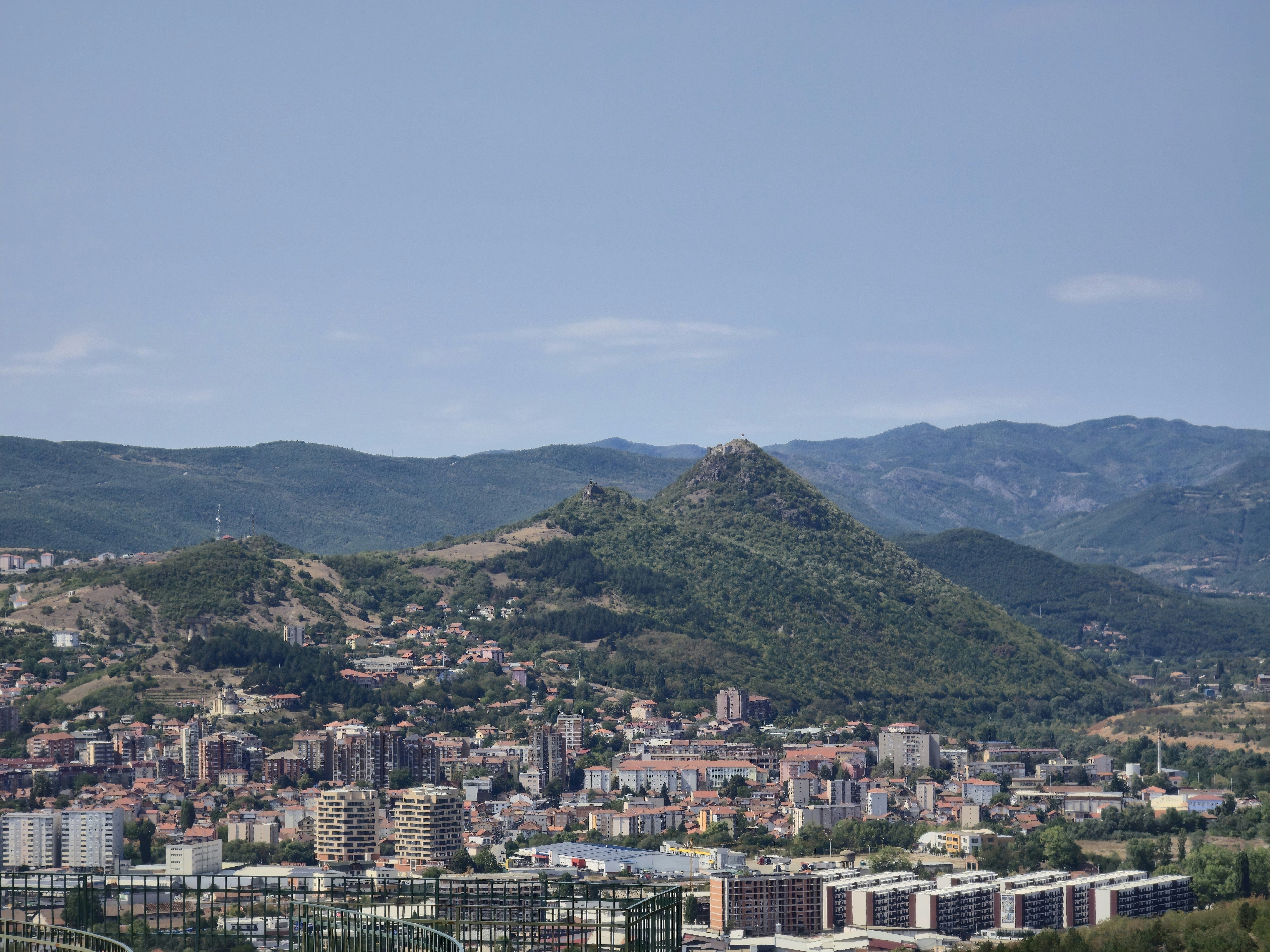 City at the Foot of a Conical Peak