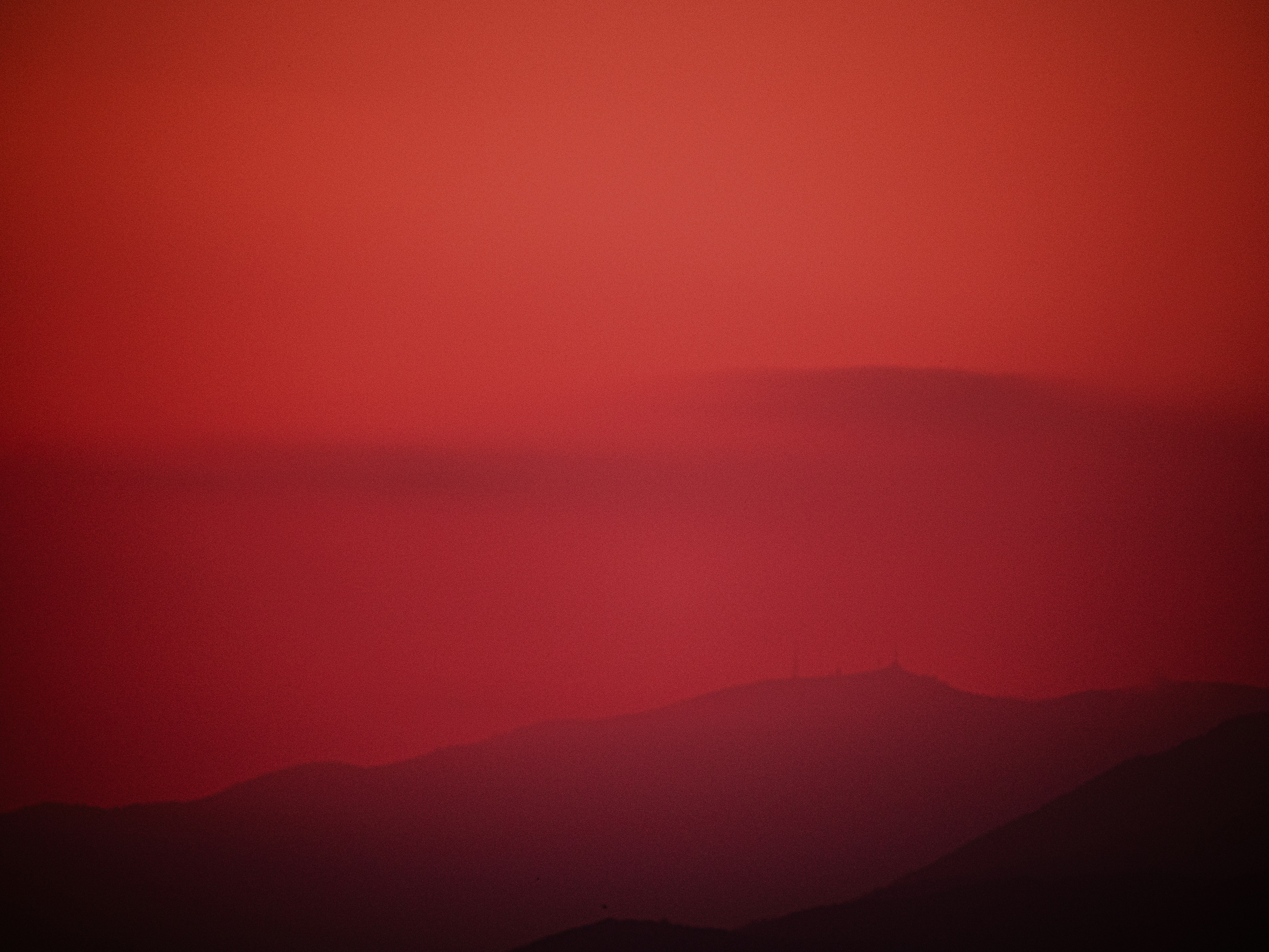 Crimson Dusk over Silent Ridges