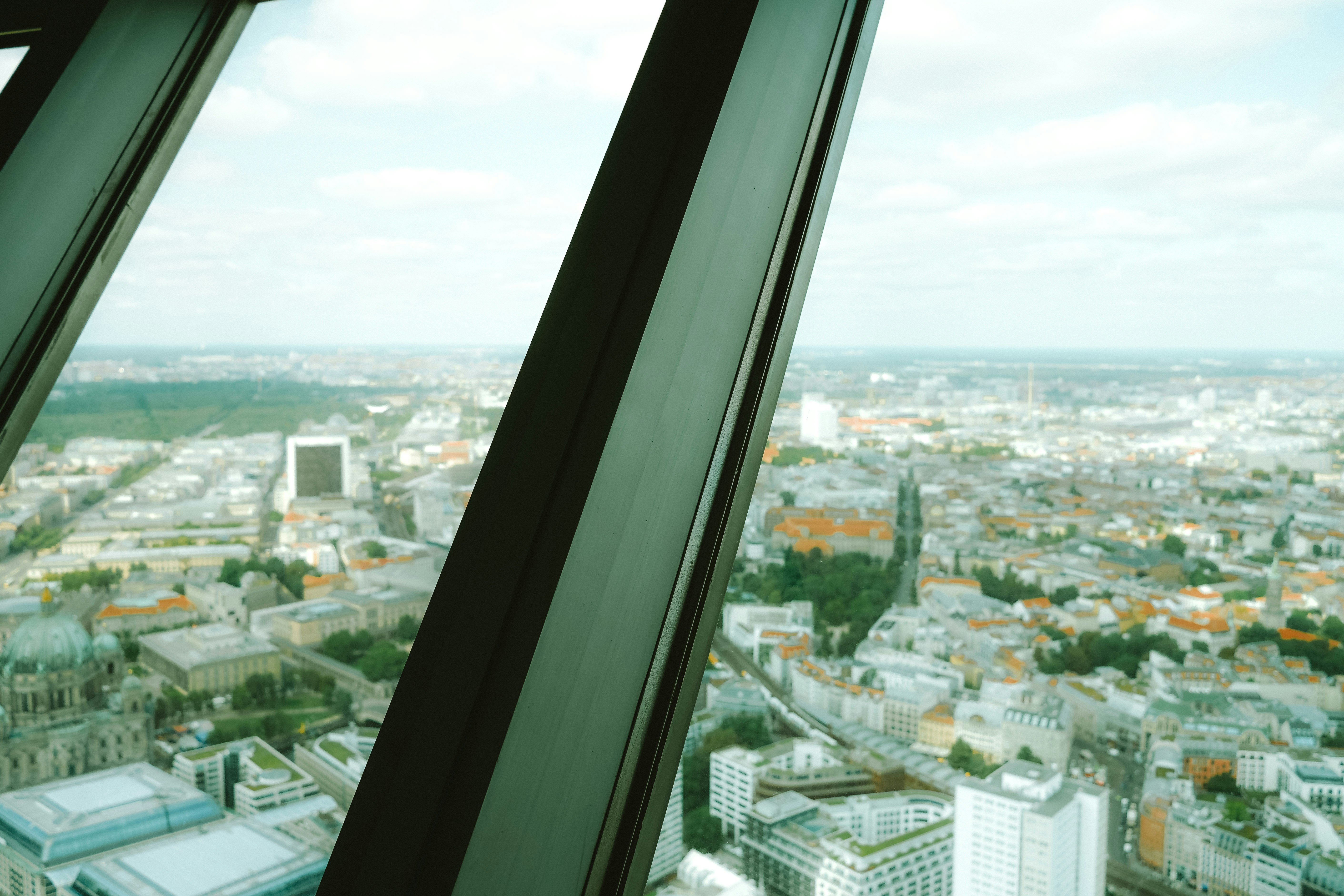Cityscape Through a Framed Window: A Horizon of Modernity