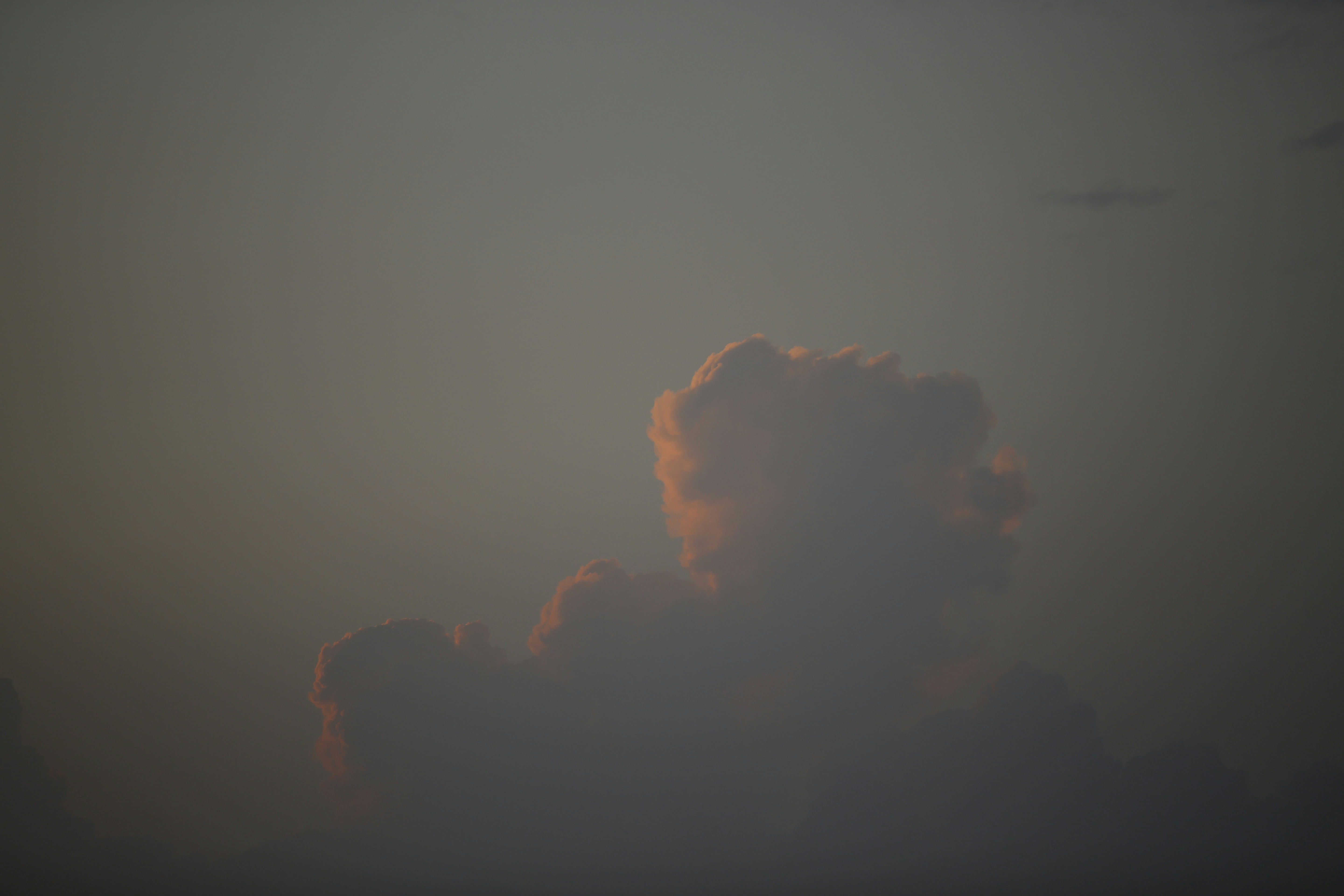 Subtle Dawn Cloud Edge Emerging from Quiet Horizon