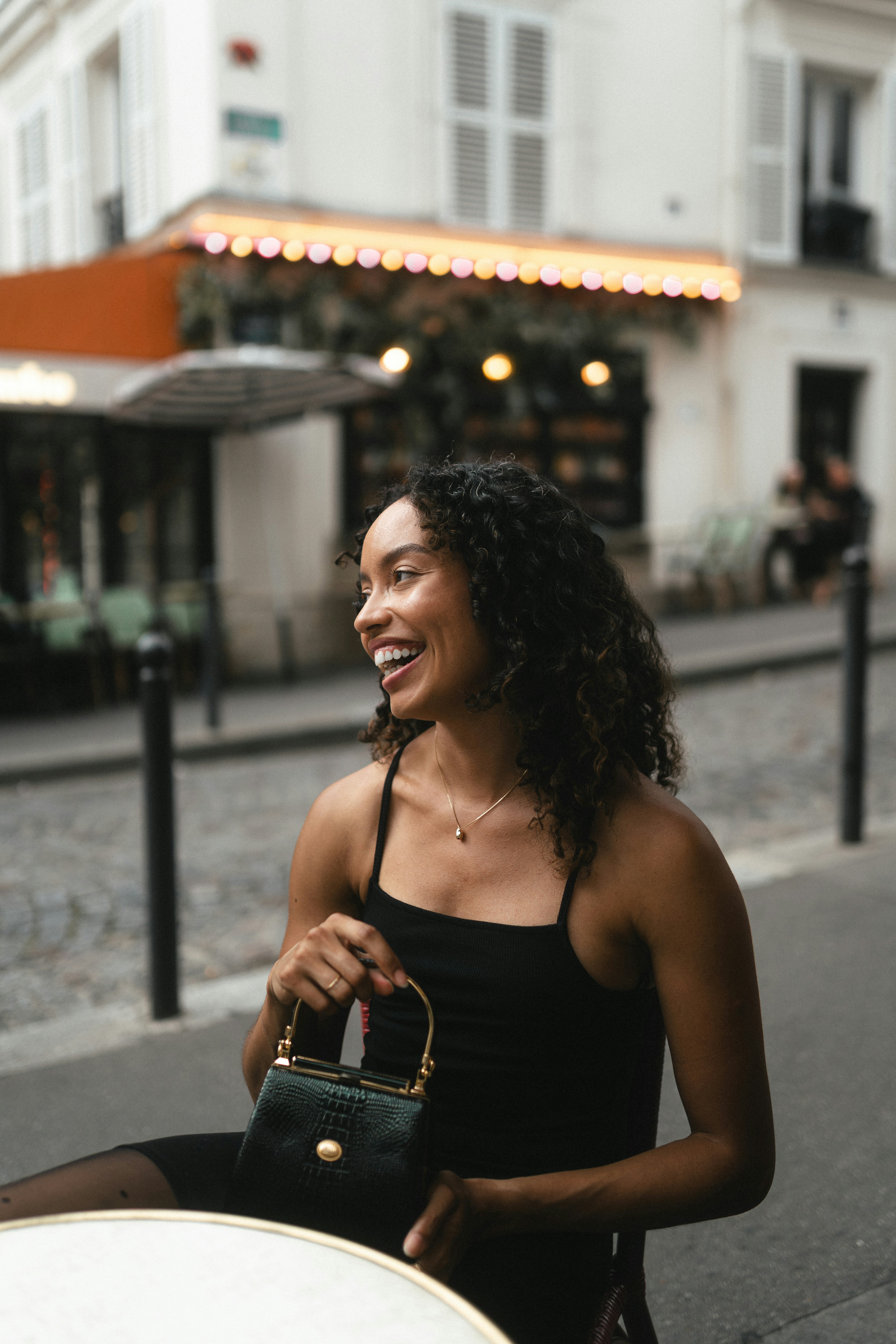 Laughing in the Café Street: A Portrait of Light and Movement