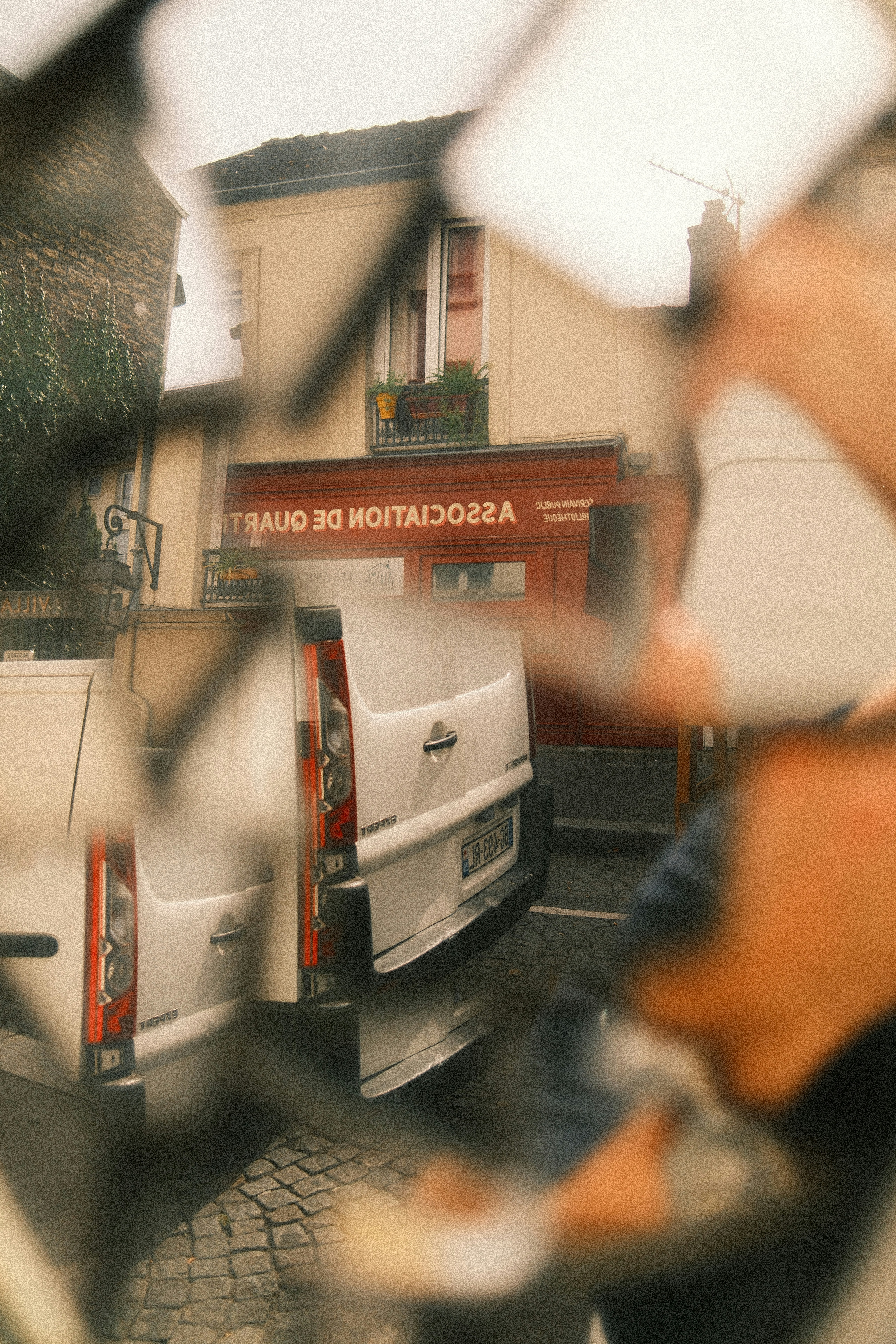 Blurred reflection, sharp street scene in a quaint European alley