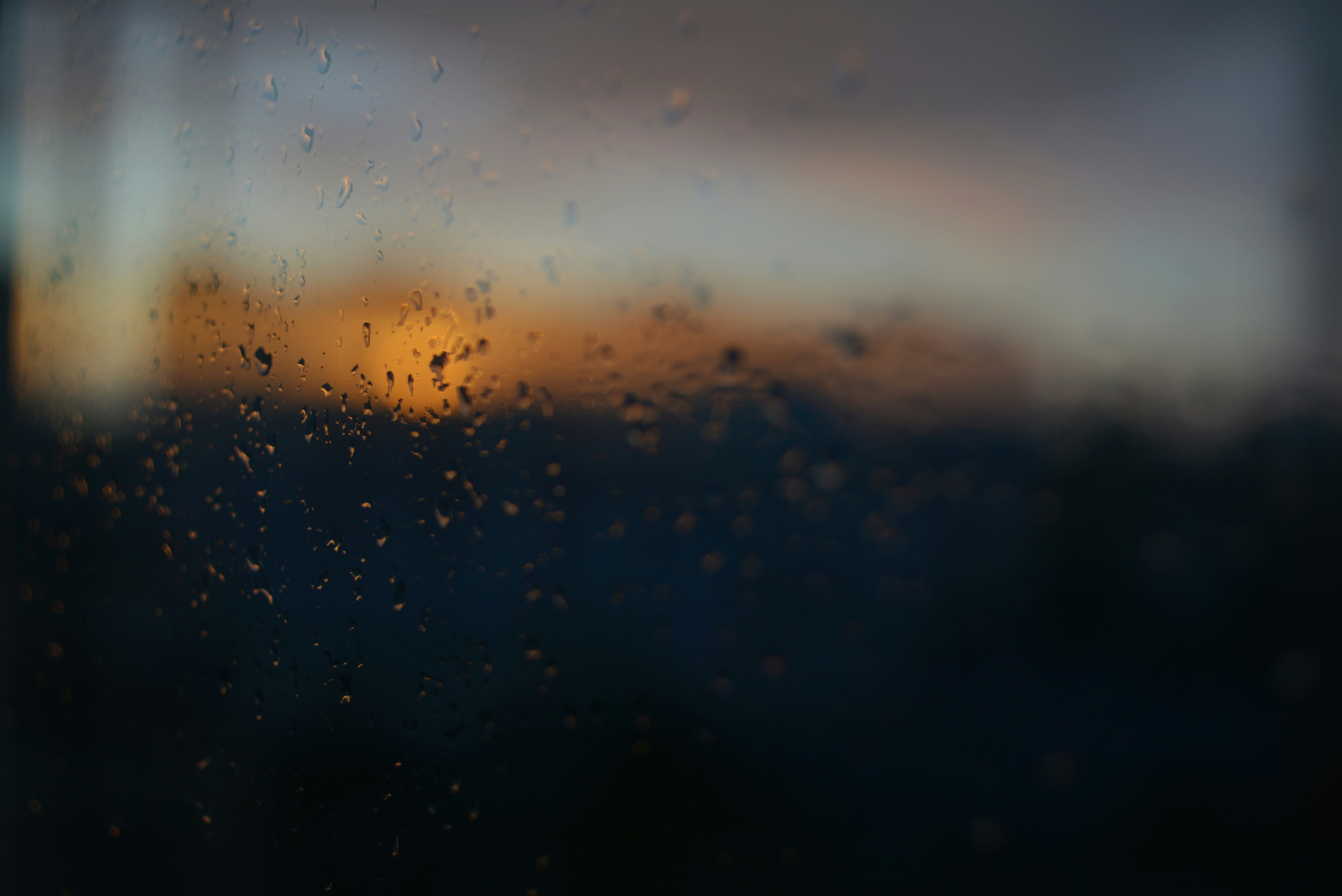 Dusk Through a Rain-Streaked Window