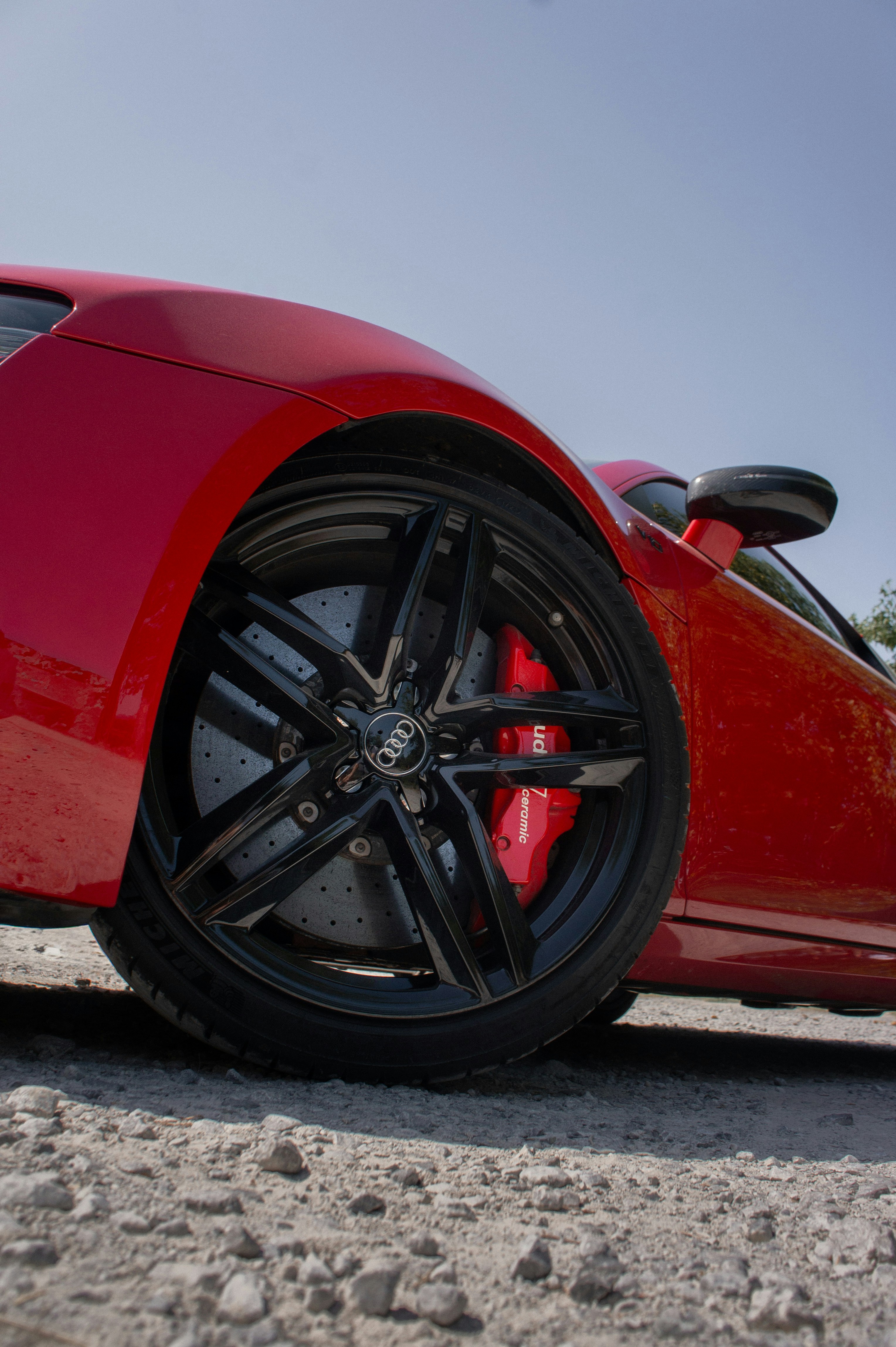 Red Torque: Close-Up of a Lamborghini-Style Rim and Brake Calipers