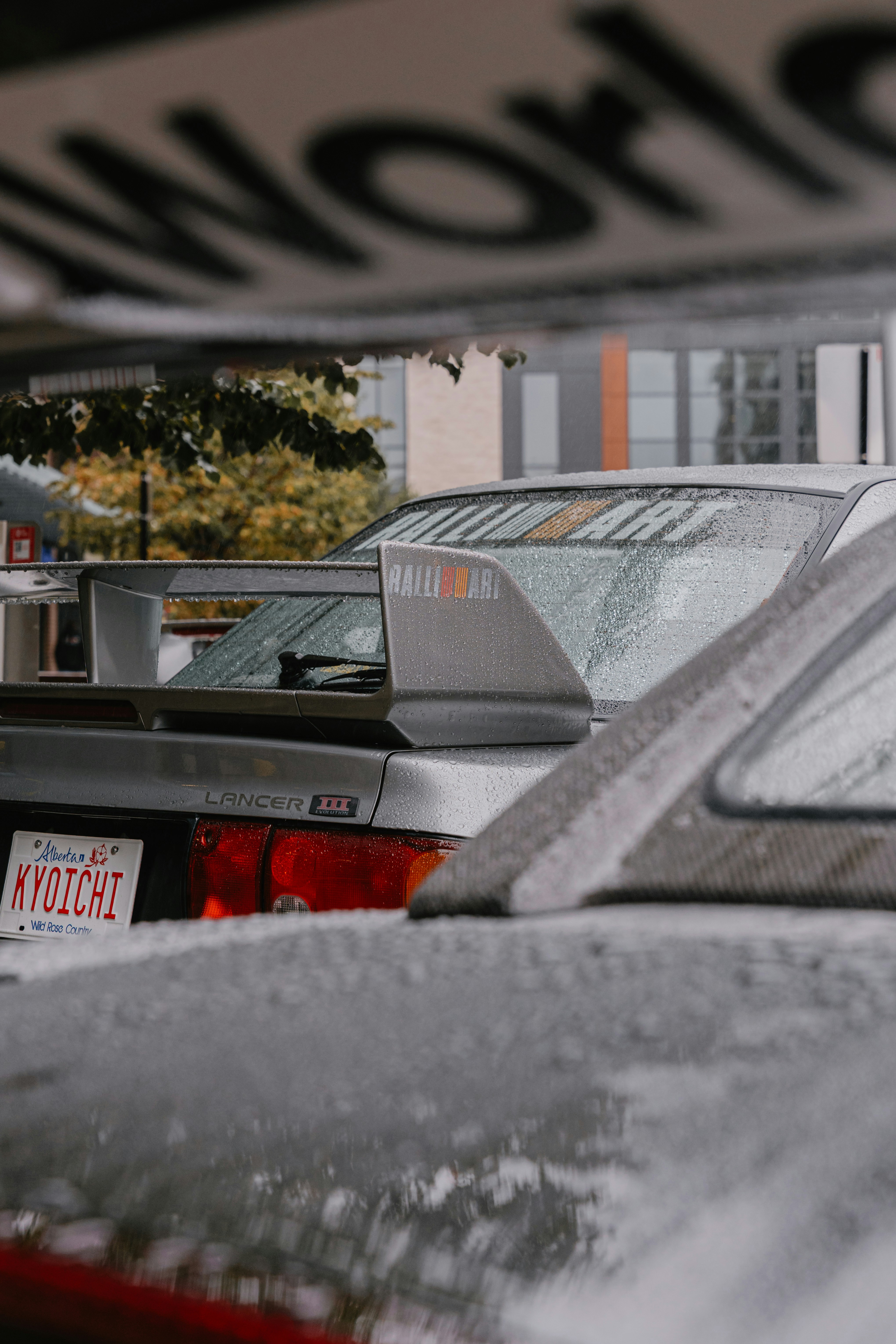 Rear Spoiler Reflection: a Quiet Parking Lot Moment