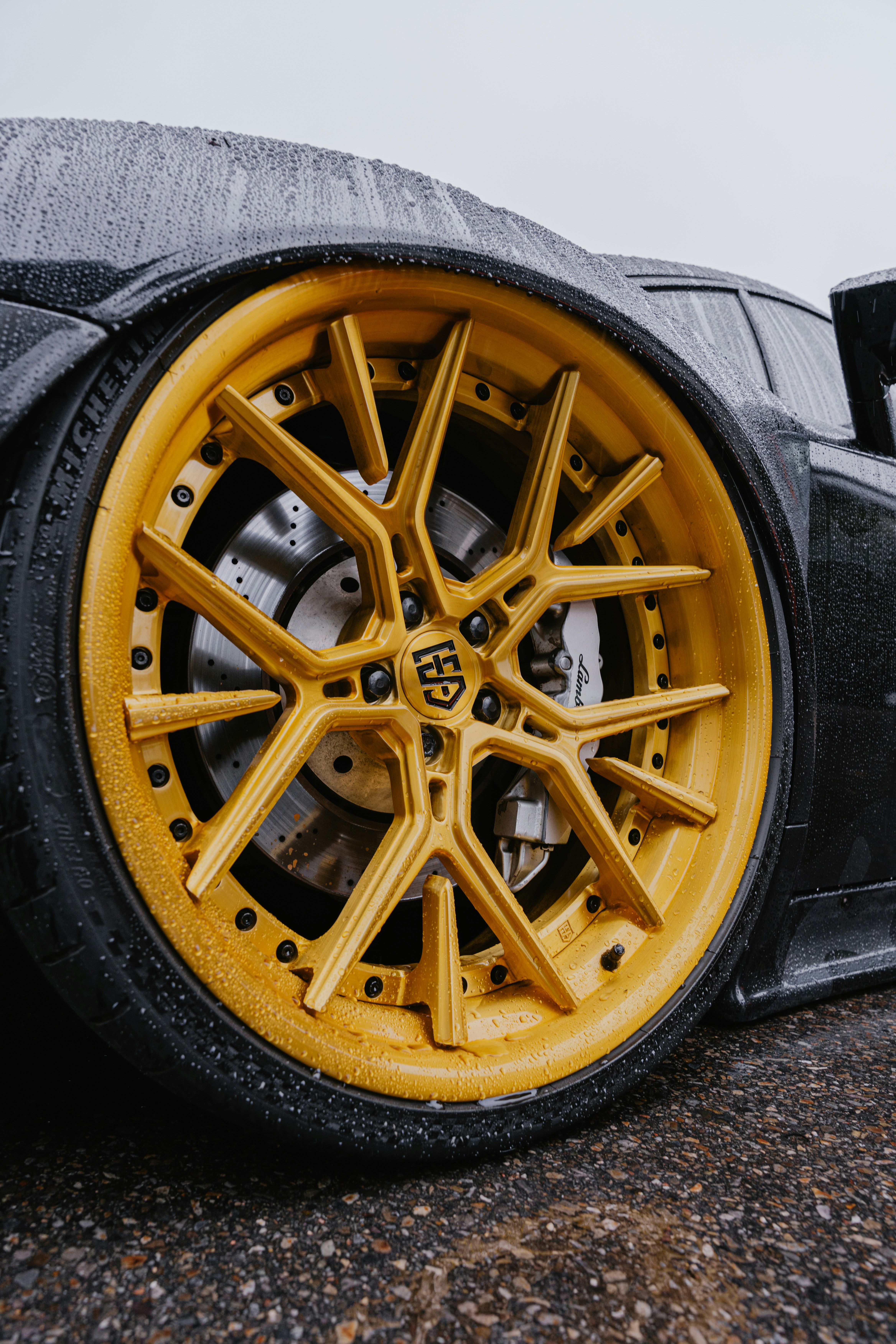 Golden Alloy Vortex: a close-up of a vivid yellow wheel with intricate spokes