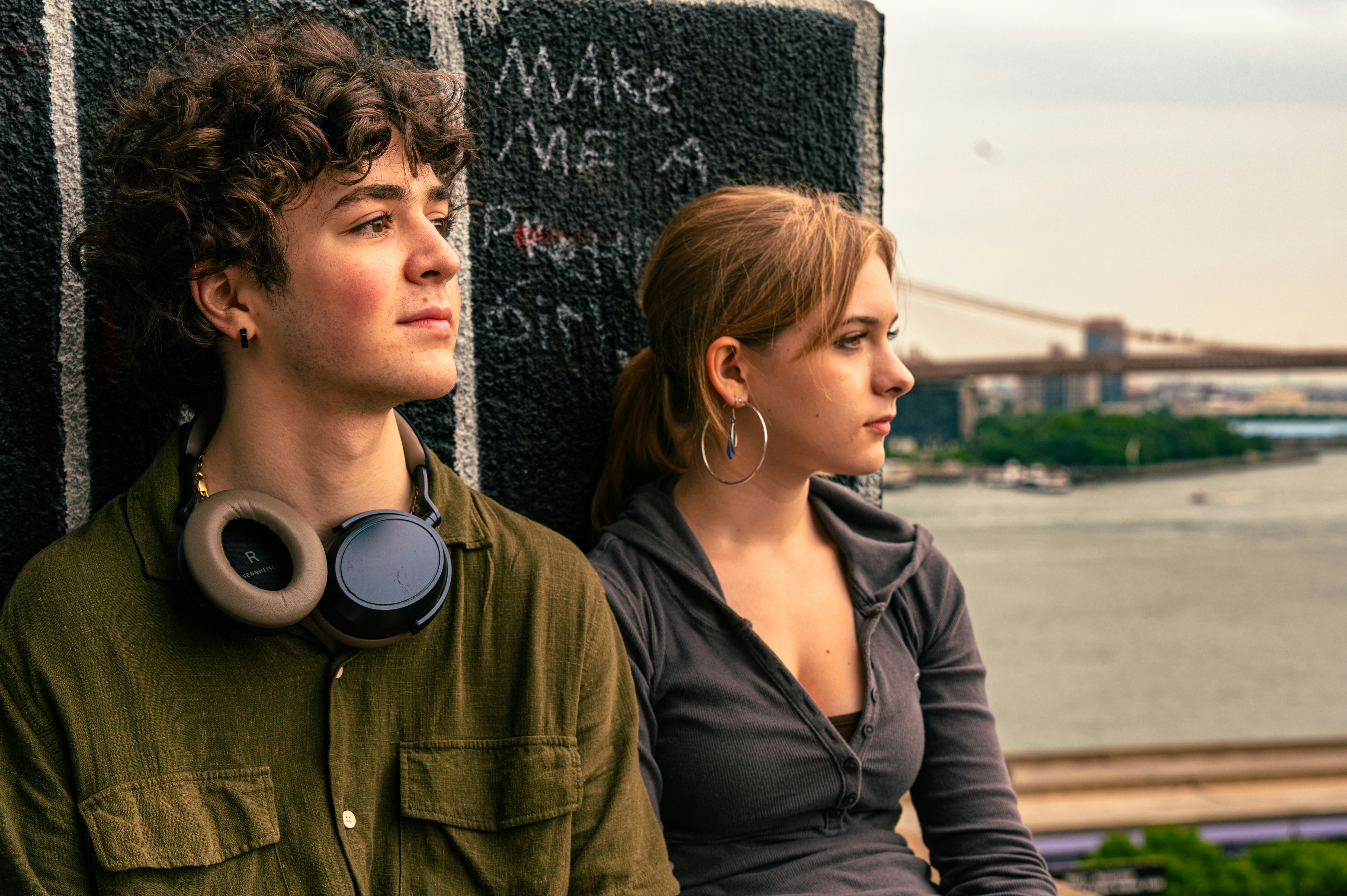 Two Friends by the Riverfront: Quiet Confidence in the Distant Light