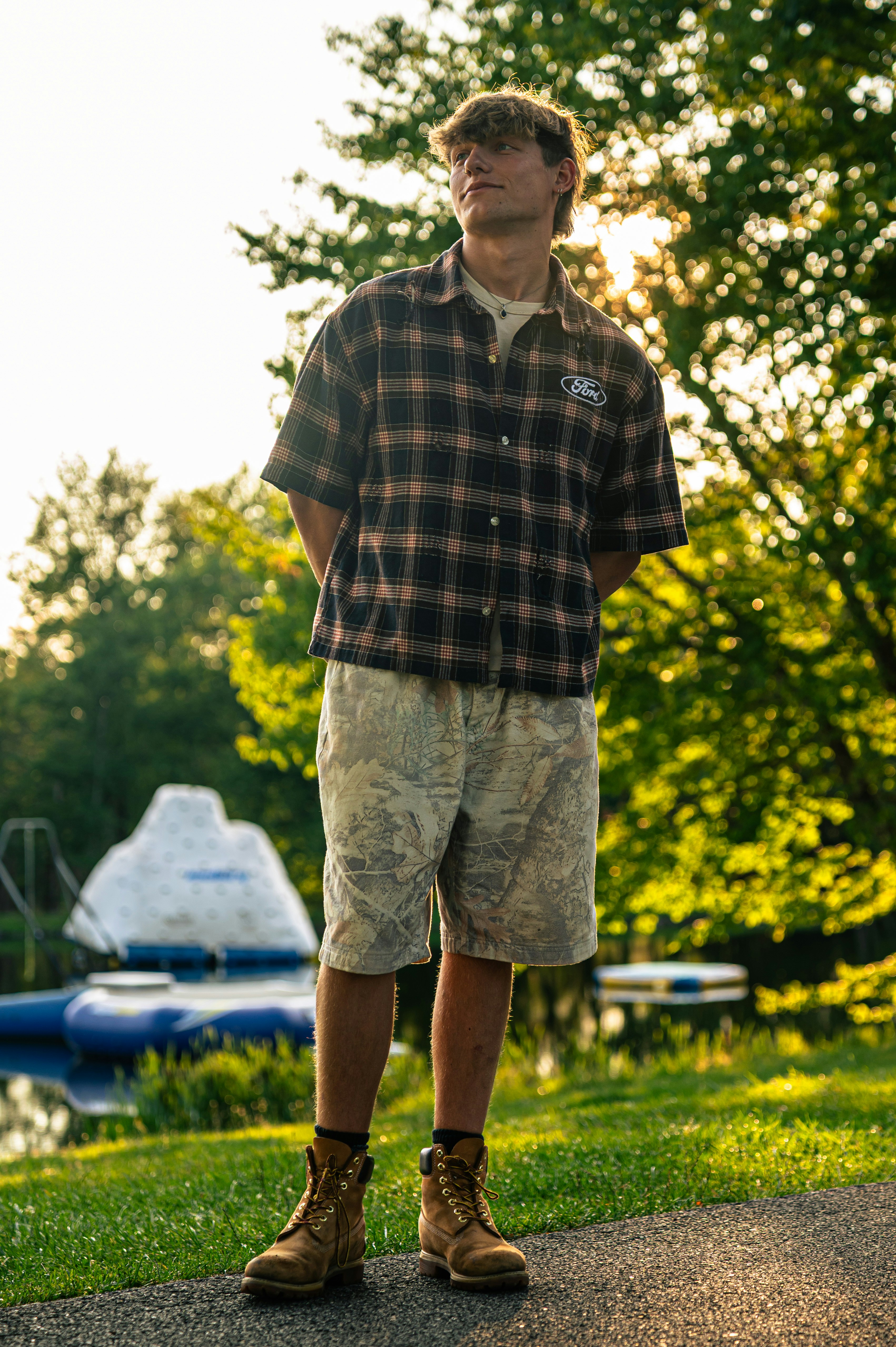 Sunlit Confidence: A Casual Portrait by the Park Pond