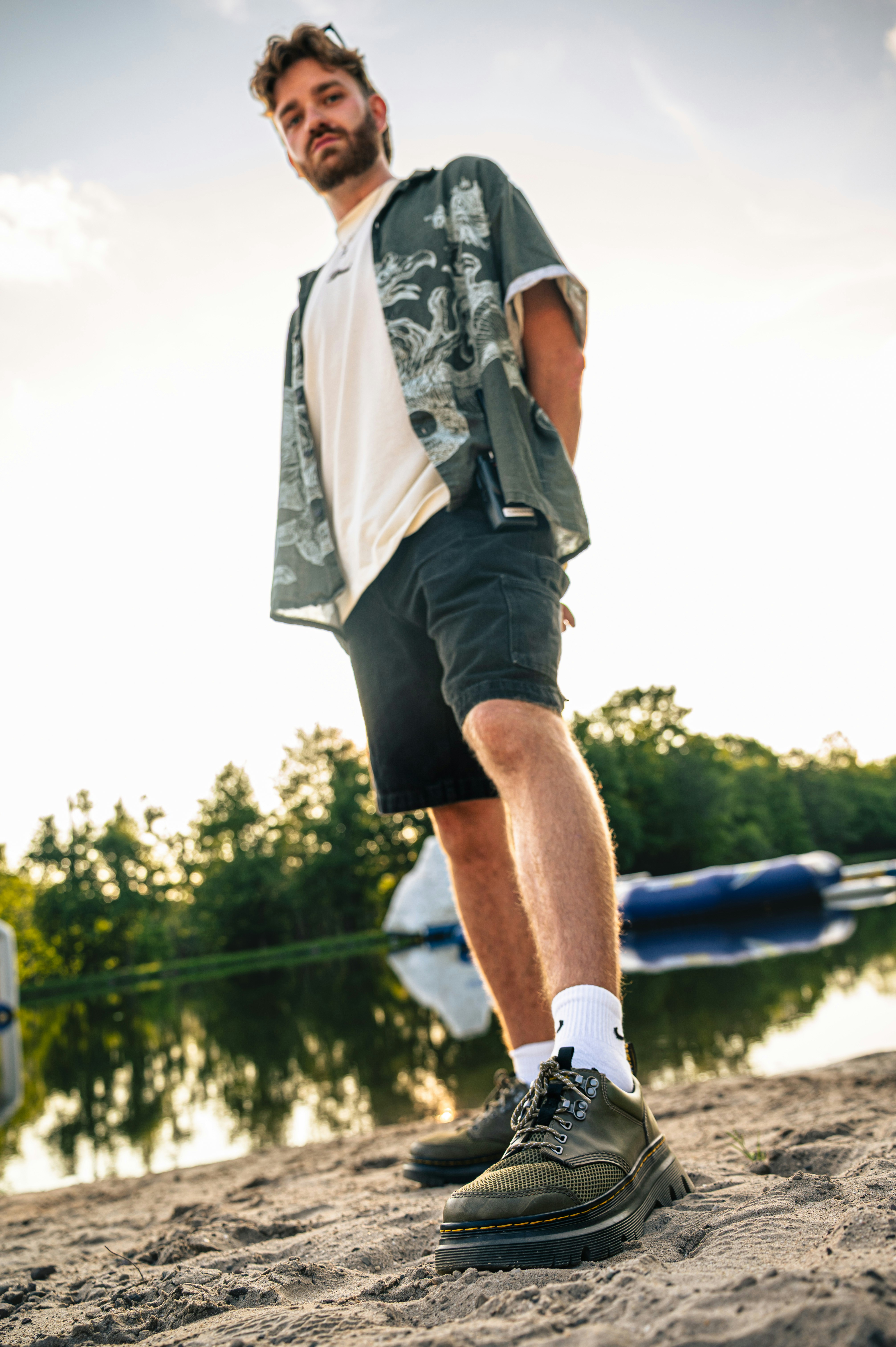 Grounded Confident: A Low-Angle Portrait on the Shore