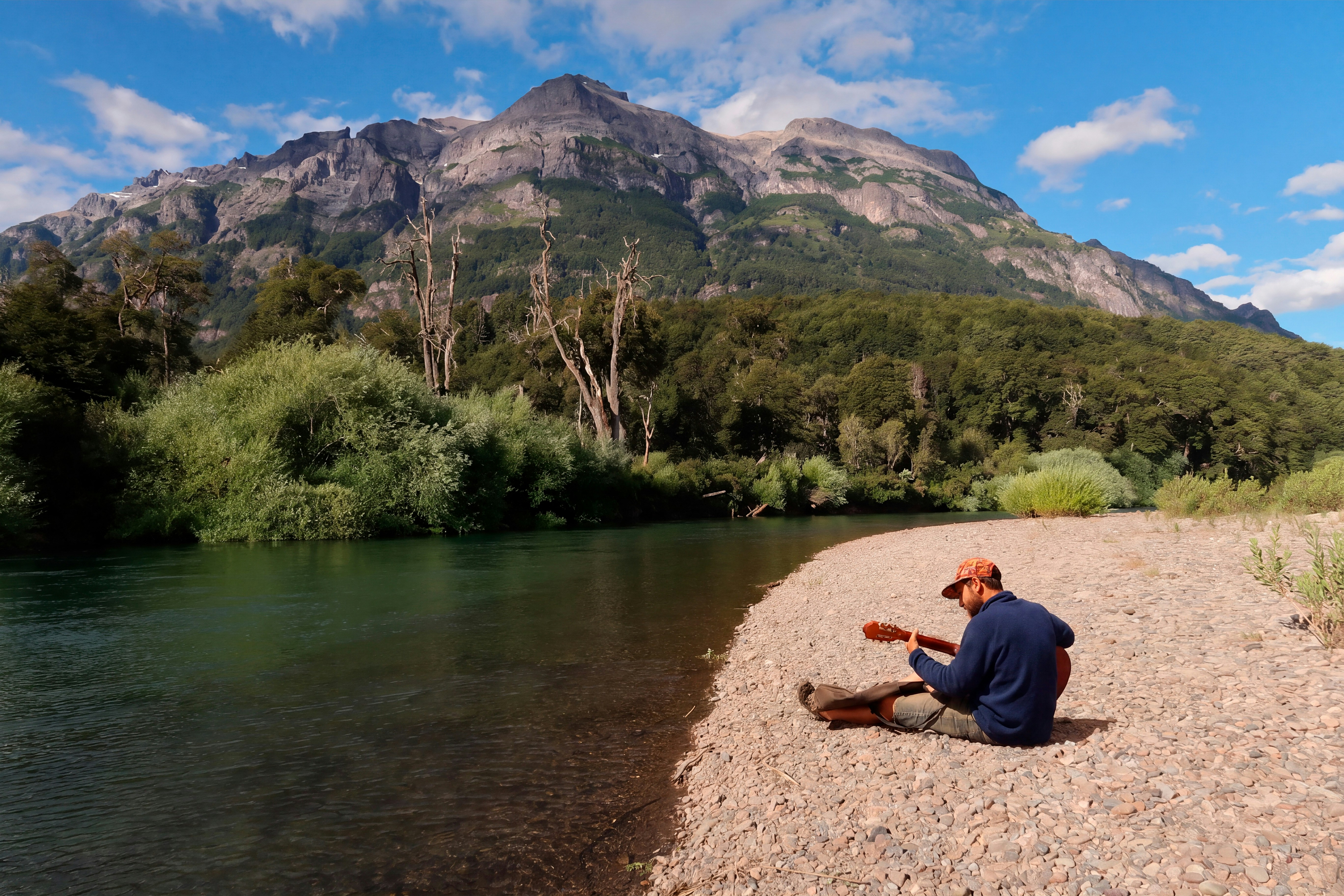 Guitar on the Riverbank: Solitude by the Mountain